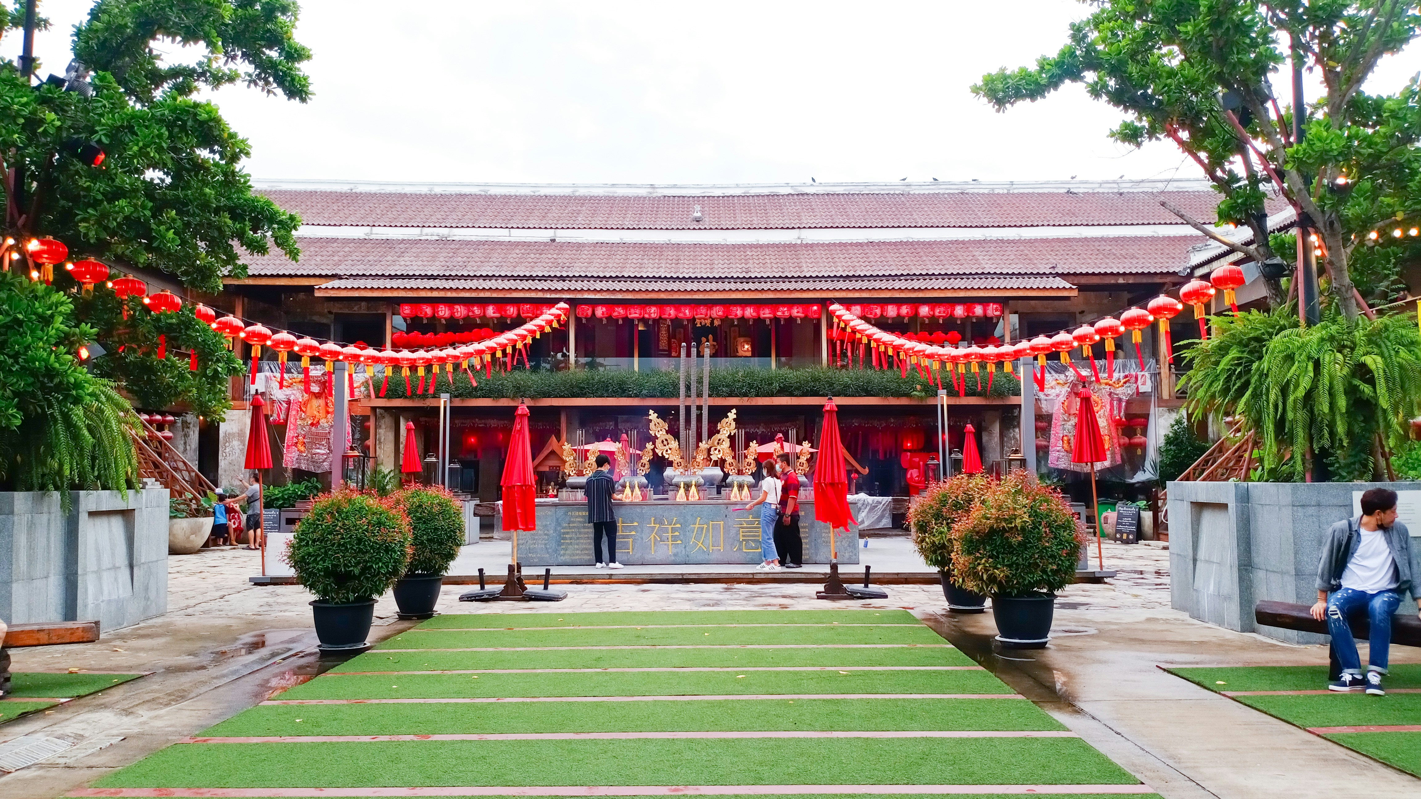 Crimson Lanterns Crown a Courtyard Stage During a Traditional Performance