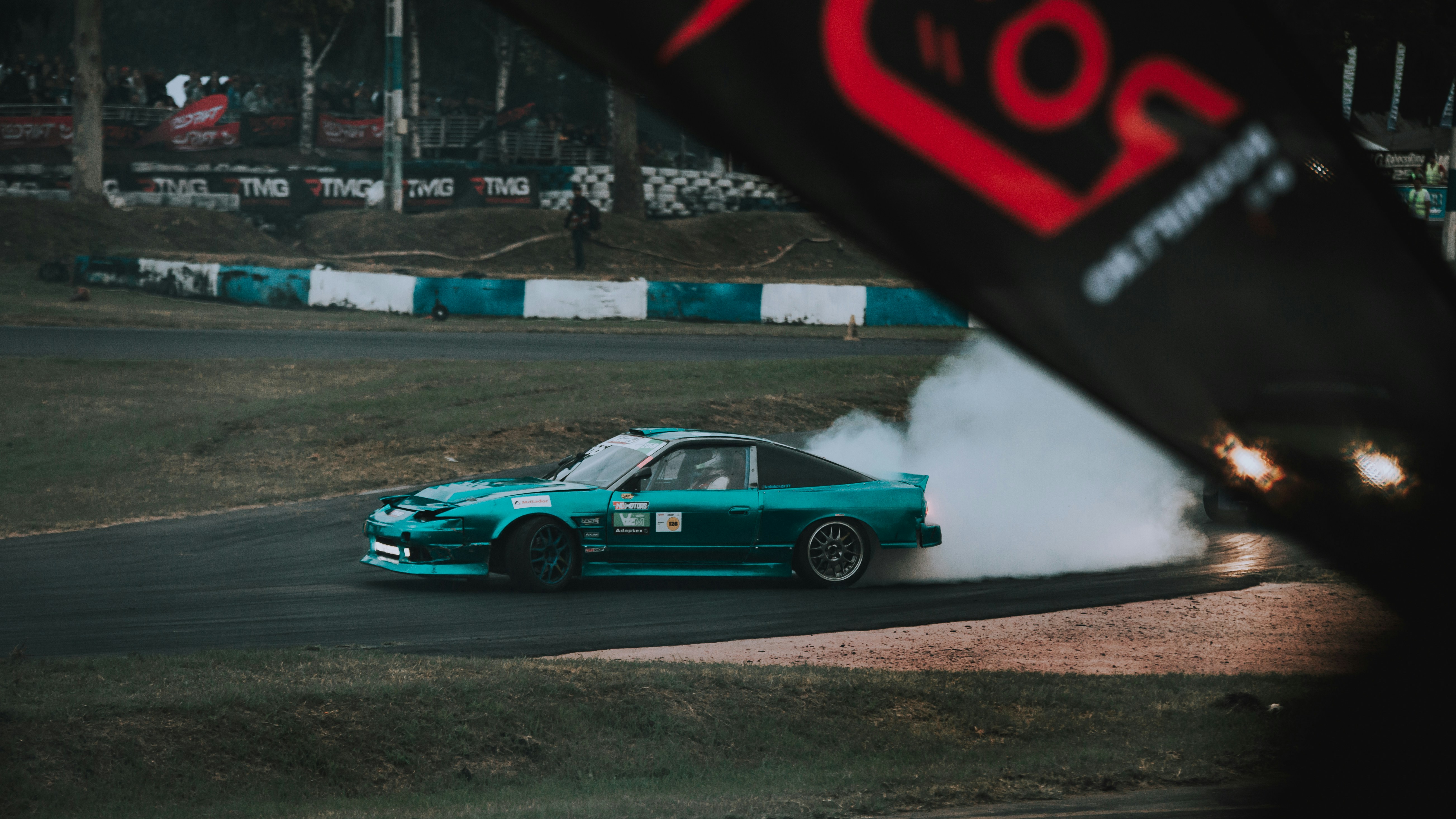 Teal Drift: Smoke-Swirling Tango on the Circuit