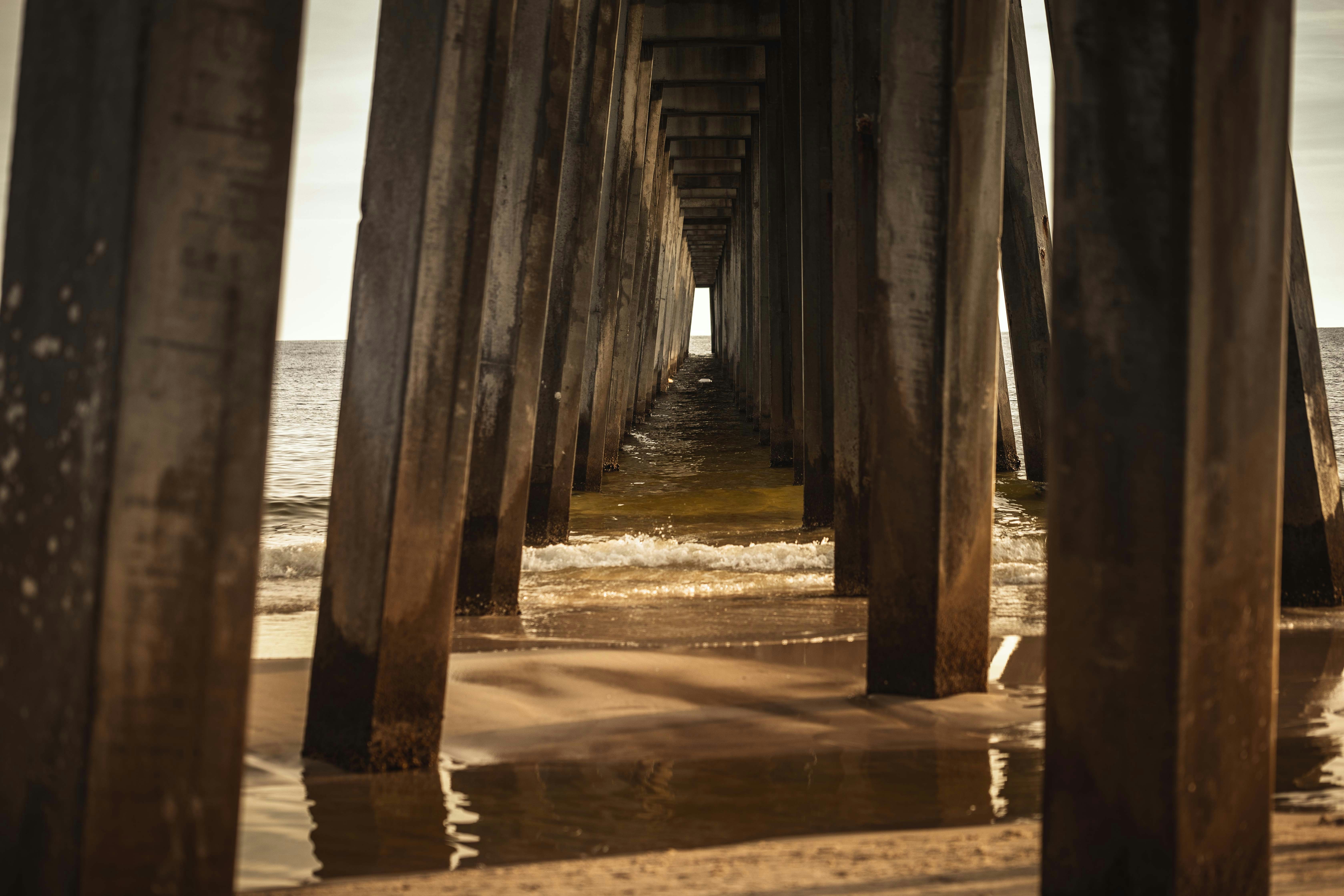 A view of the ocean from underneath a pier photo – Free Panama city ...