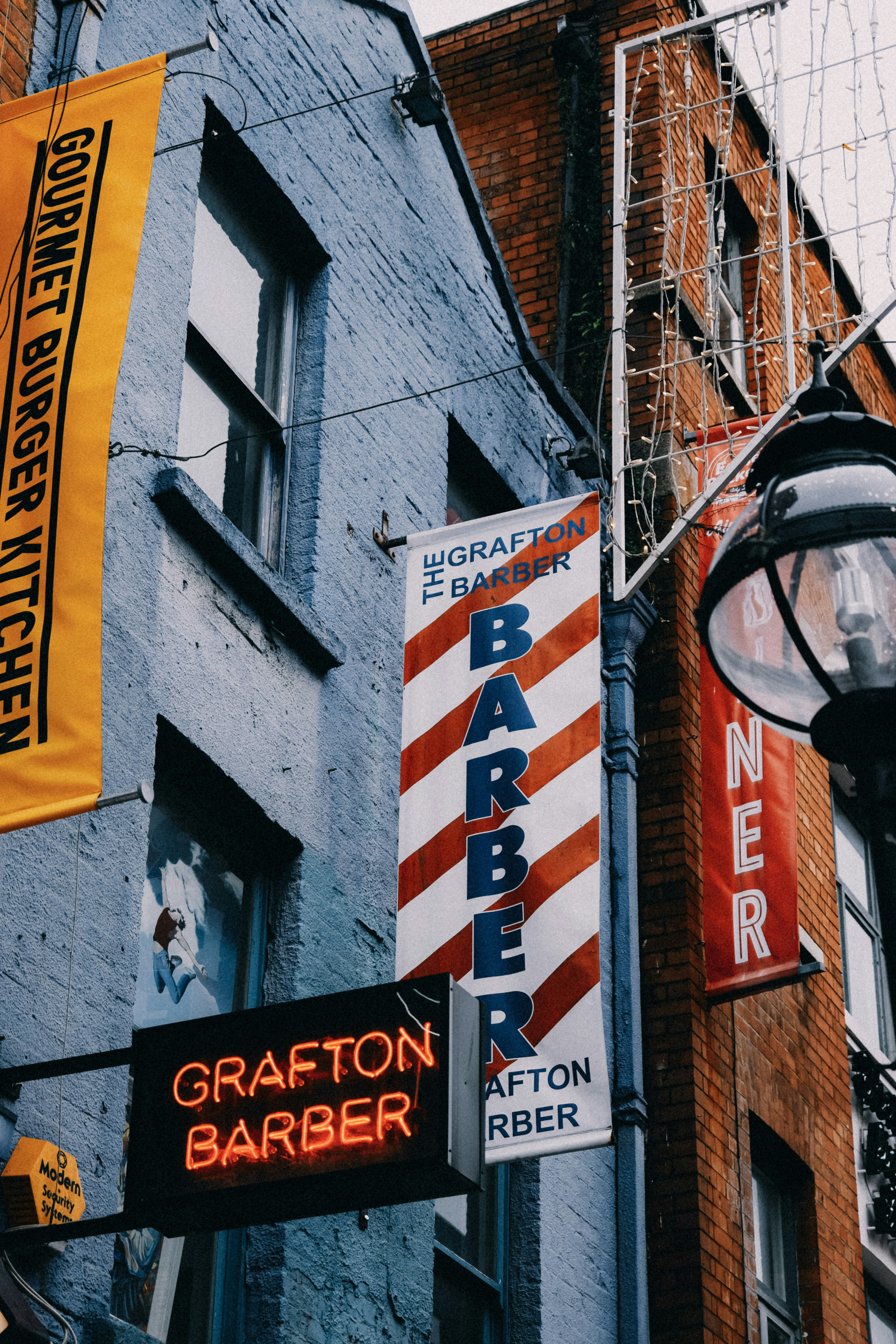 Stripes and Neon: A Bustling Barber Row in Neon Light