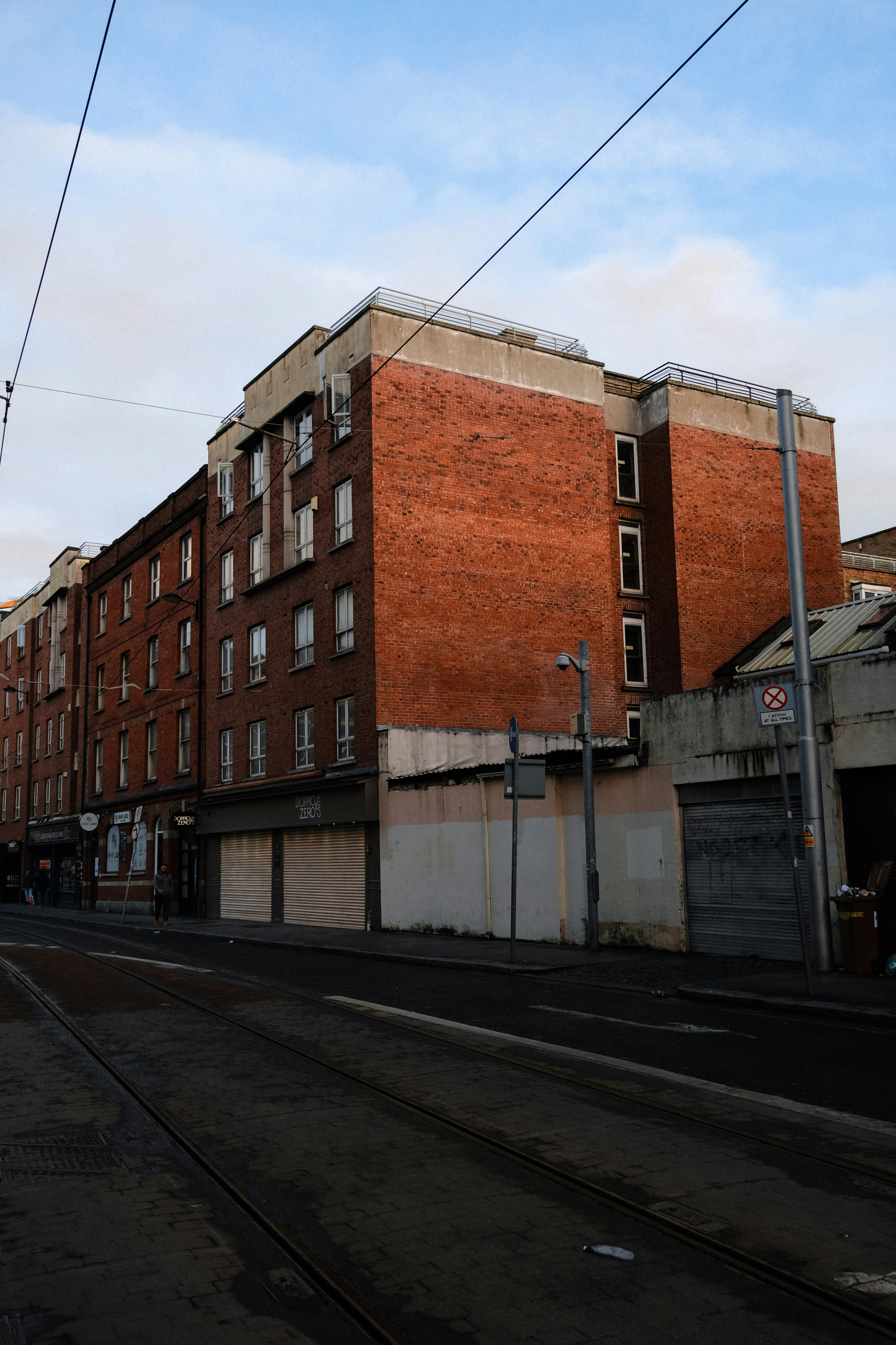 A red brick building sitting on the side of a road photo – Free Dublin ...