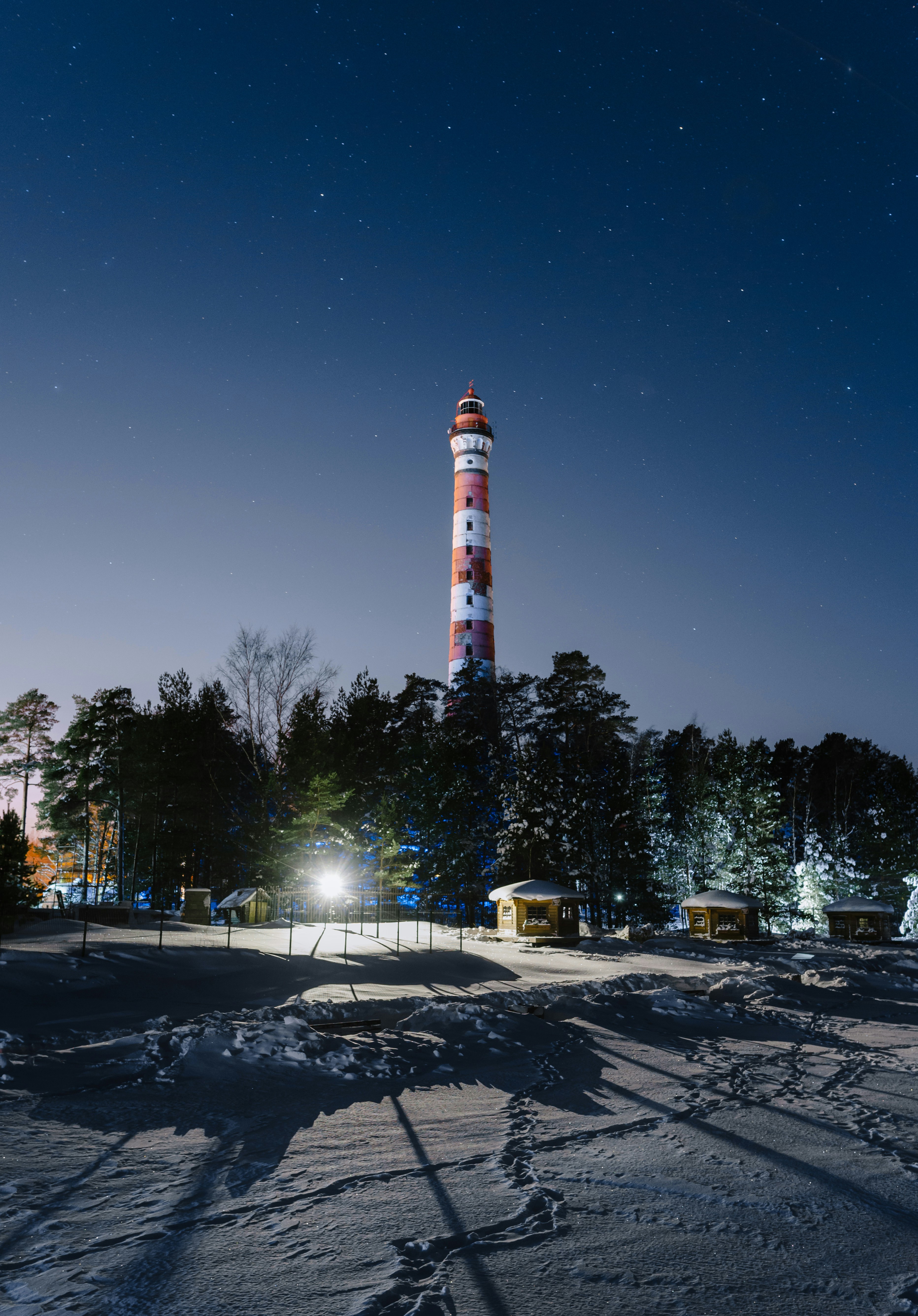Stripe-lit Sentinel Under a Star-Filled Night