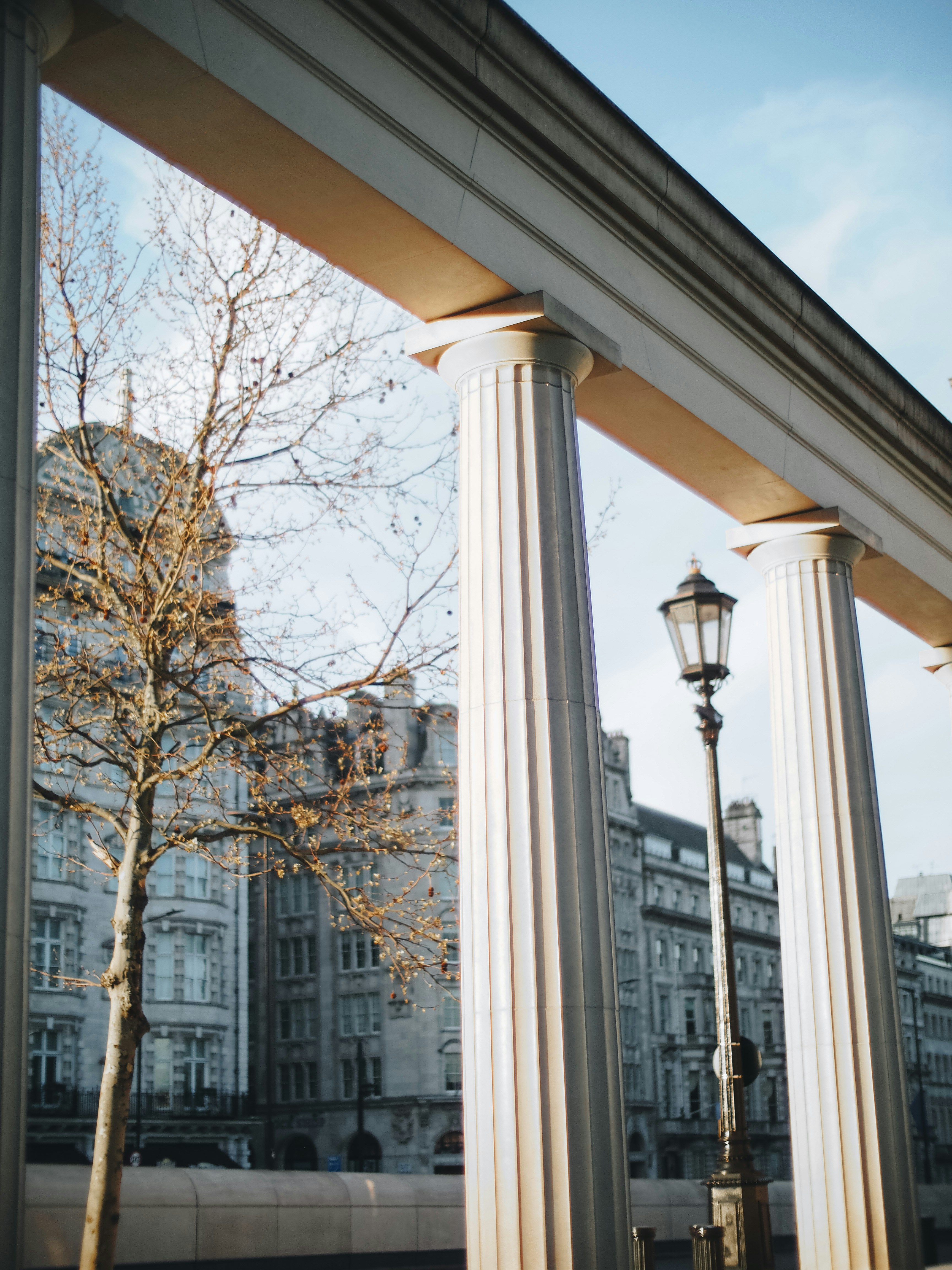 A view of a building through a window photo – Free Building Image on ...