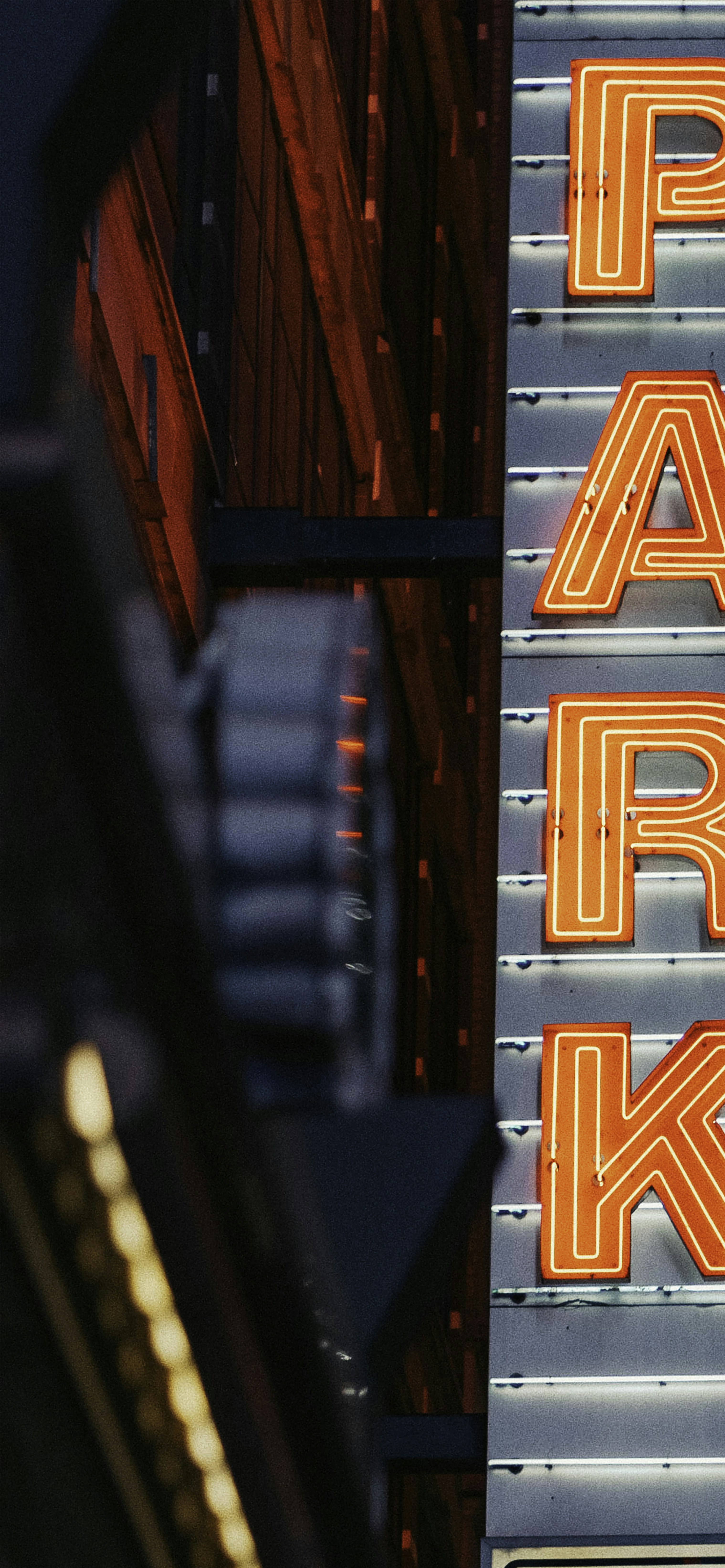 A large neon sign that says park next to a building photo – Free ...