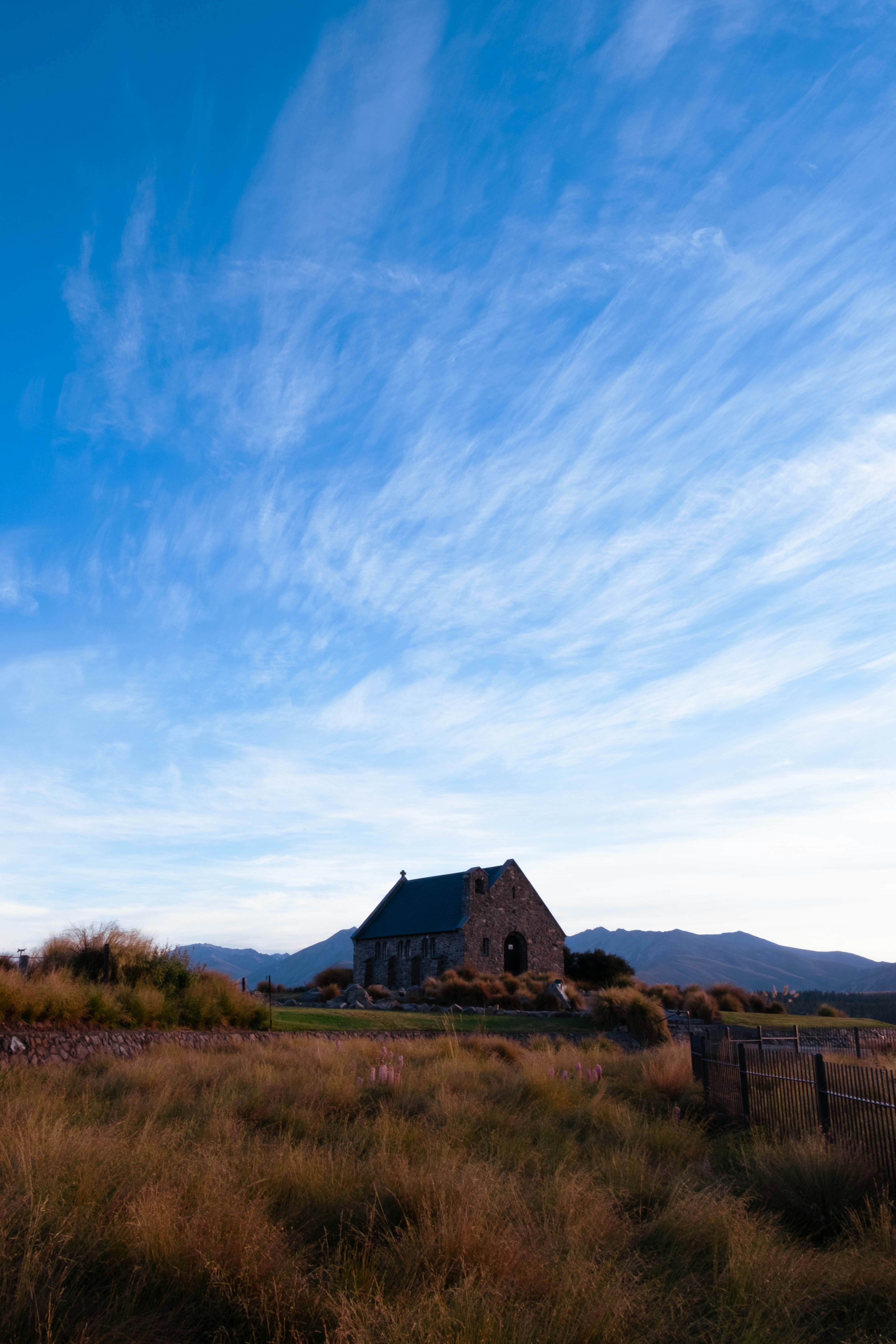 Stone Cottage at the Prairie Edge Beneath an Expansive Sky
