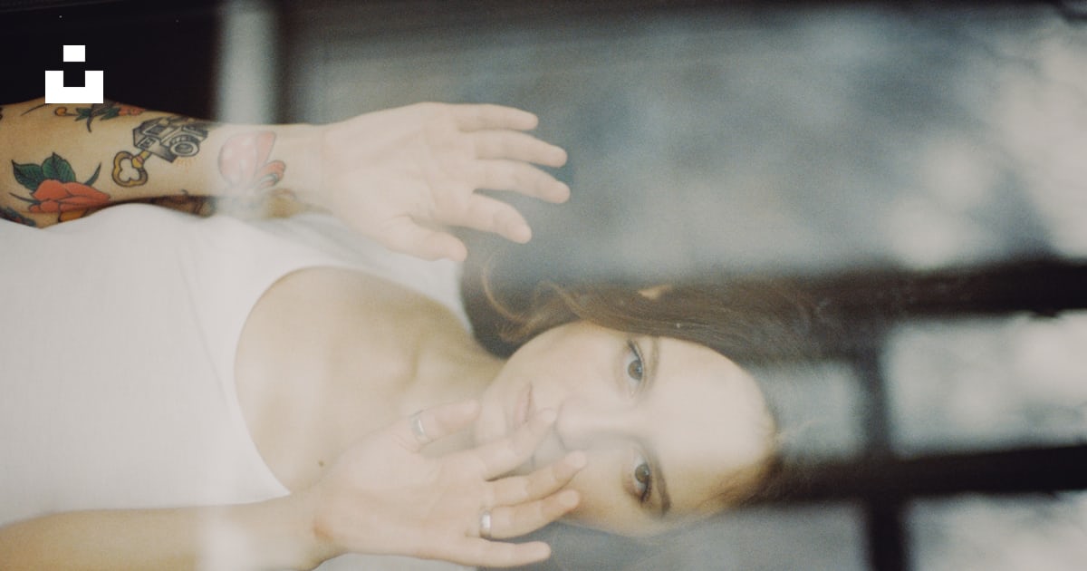 A Woman With A Tattoo On Her Arm Photo Free Film Photography Image On