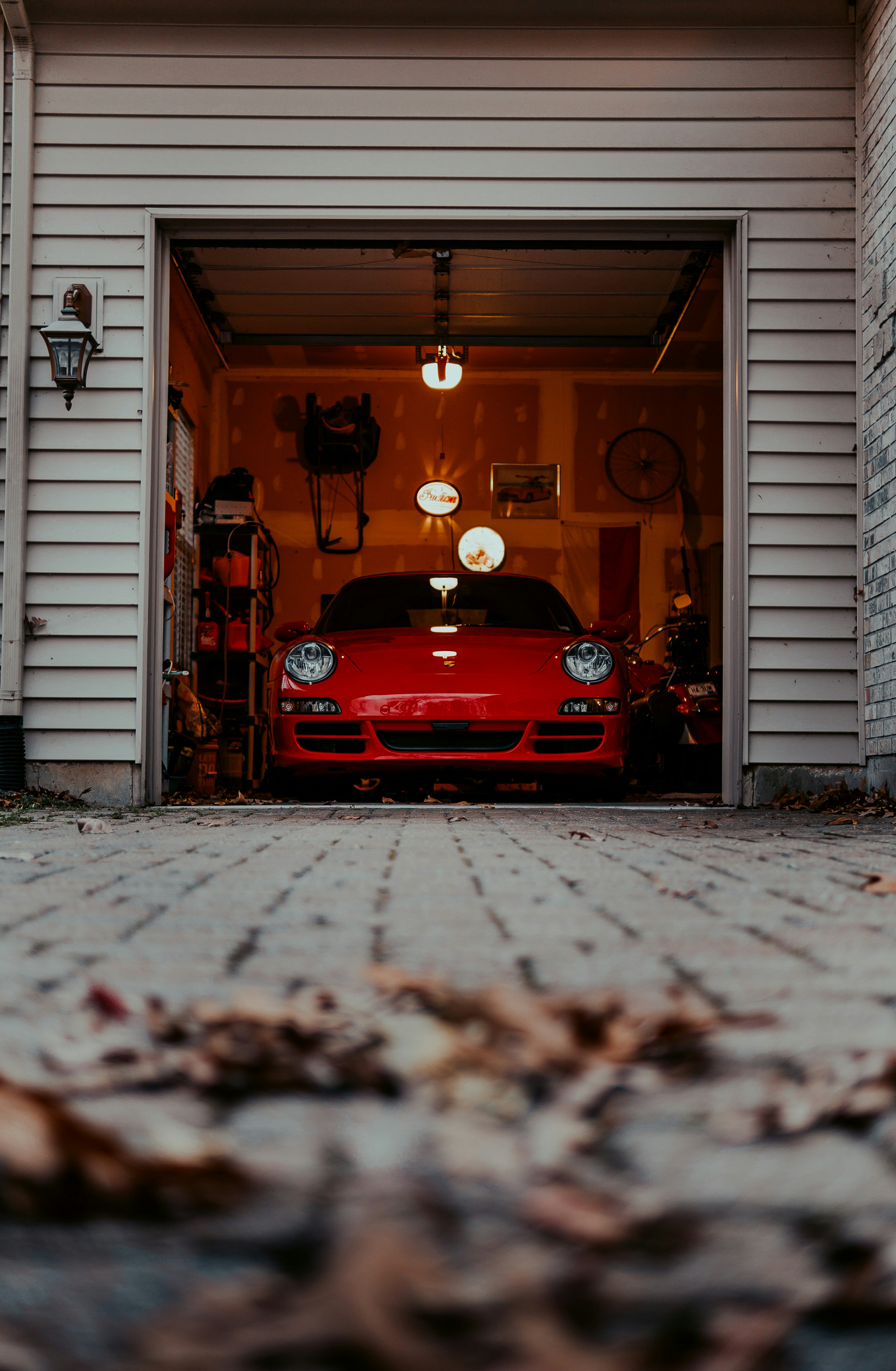 a red car is parked in a garage