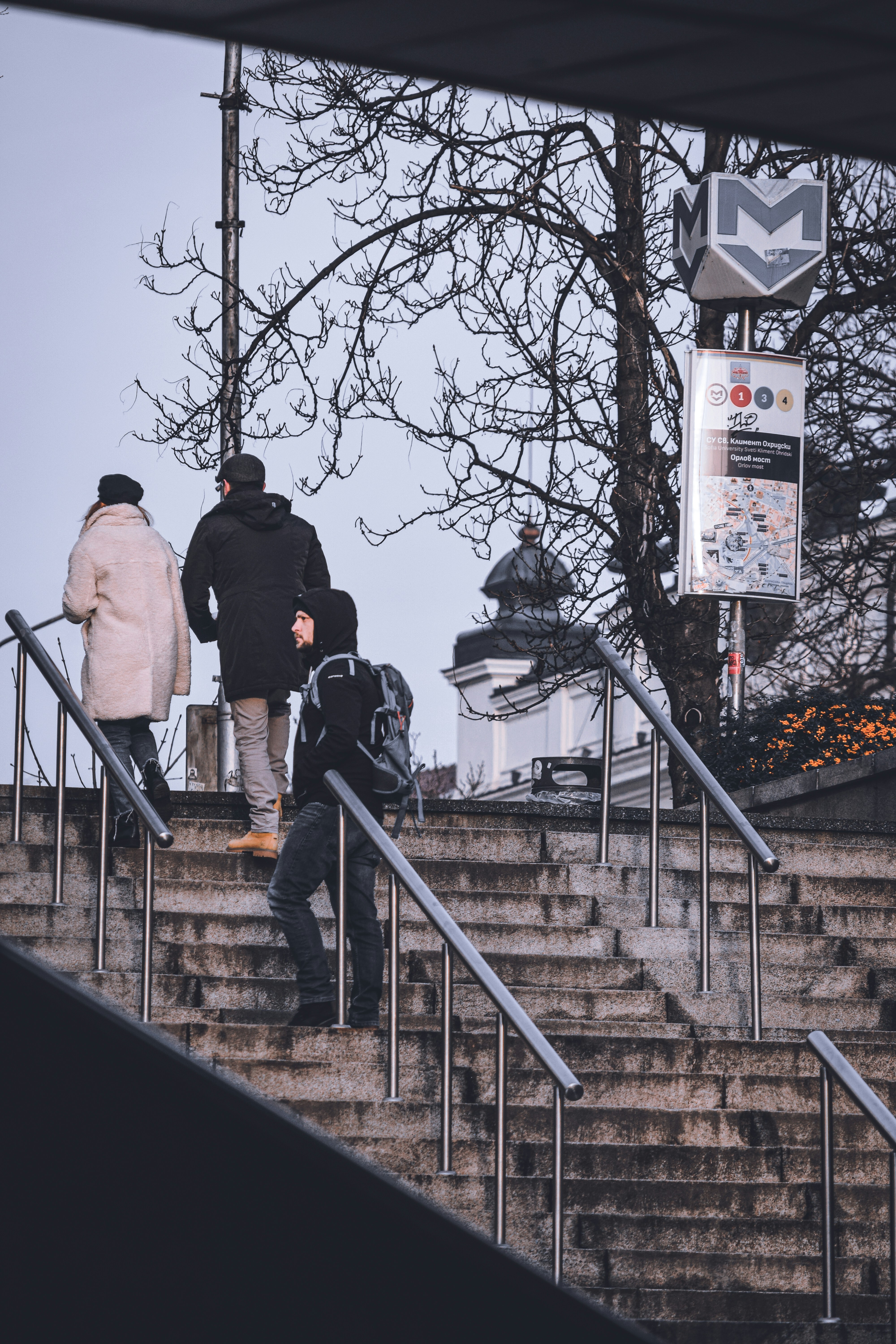 A group of people walking up a flight of stairs photo – Free Human ...