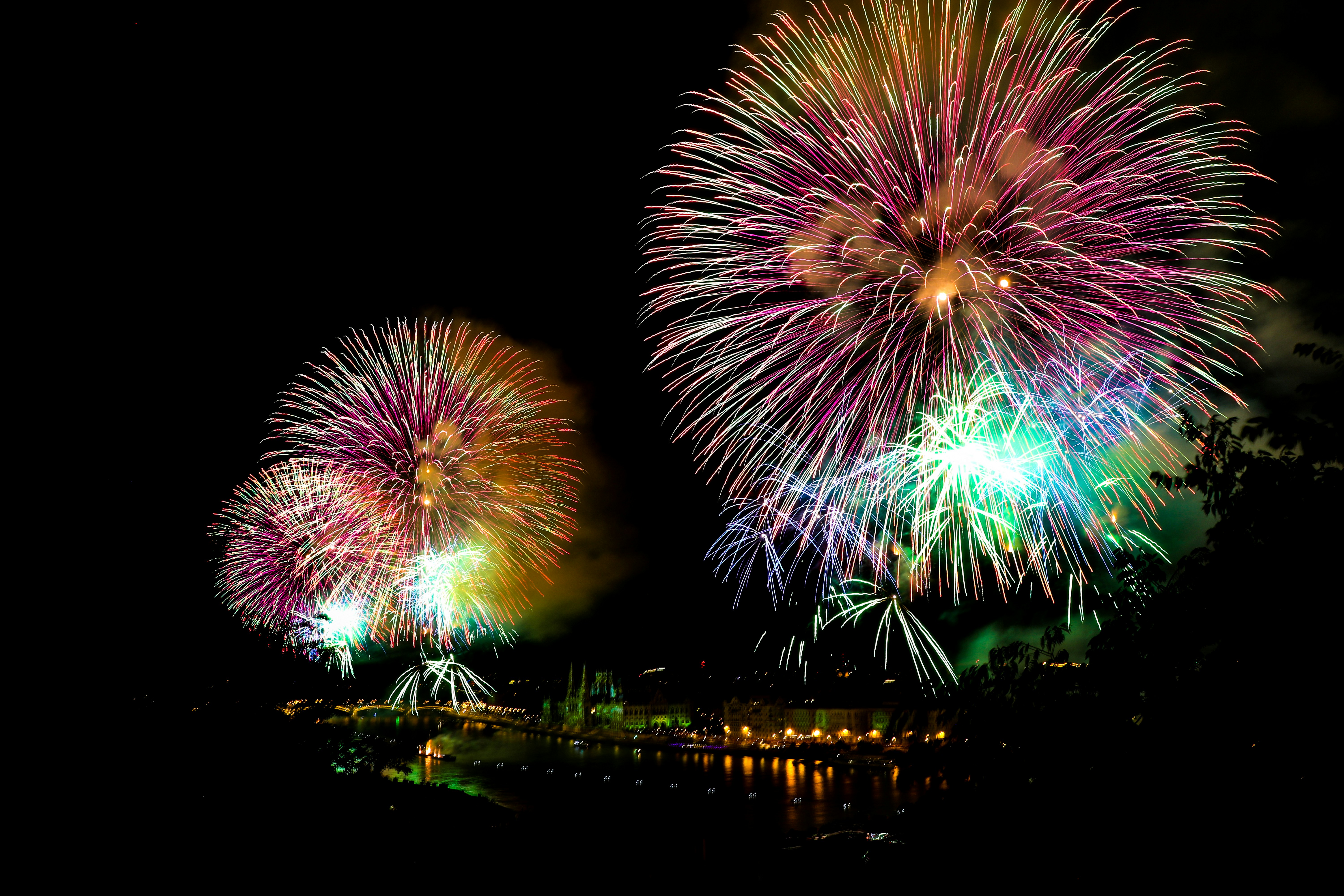 A group of fireworks are lit up in the night sky photo – Free Nature ...