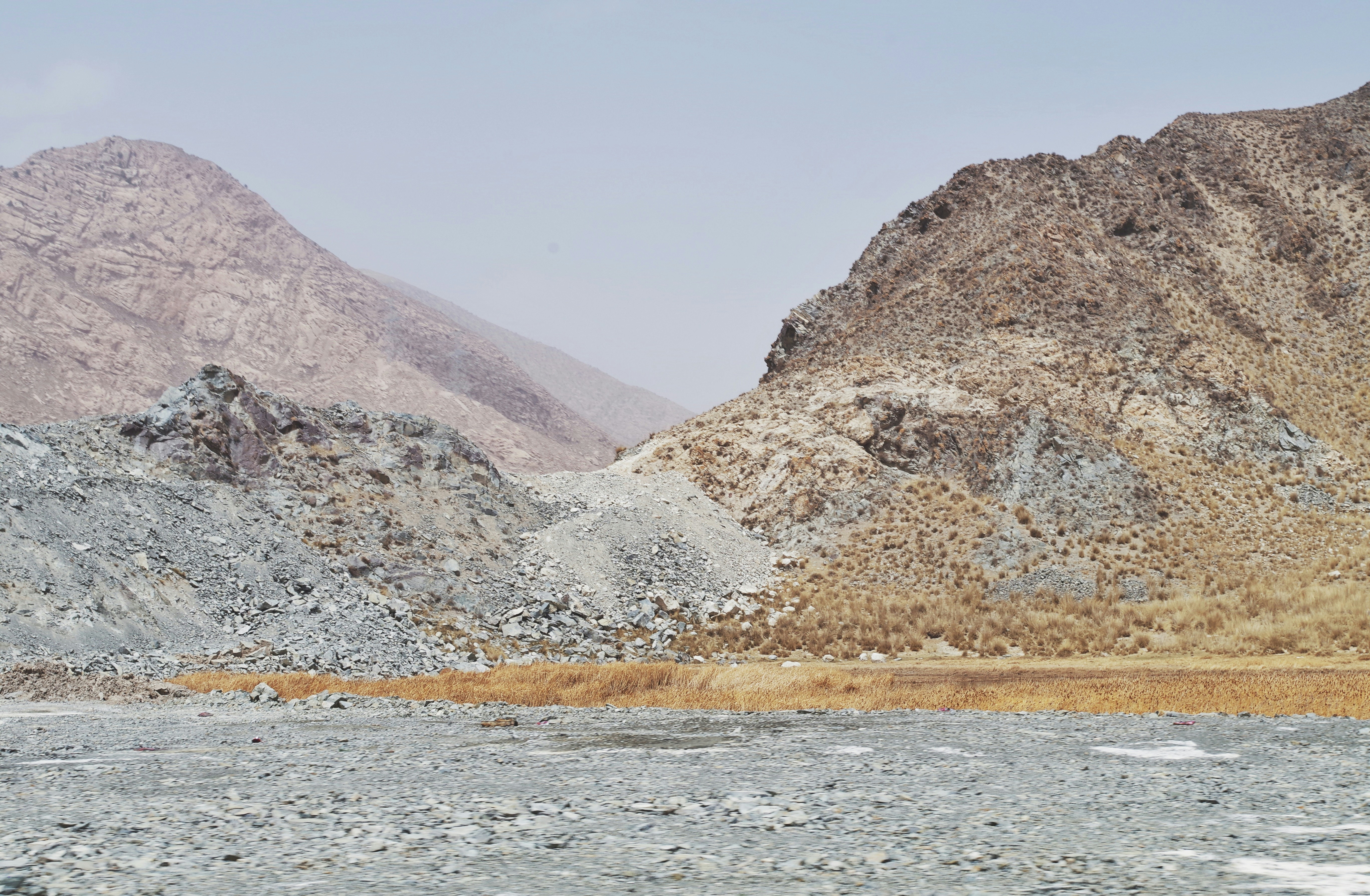 Golden Band Across a Rugged Desert Basin