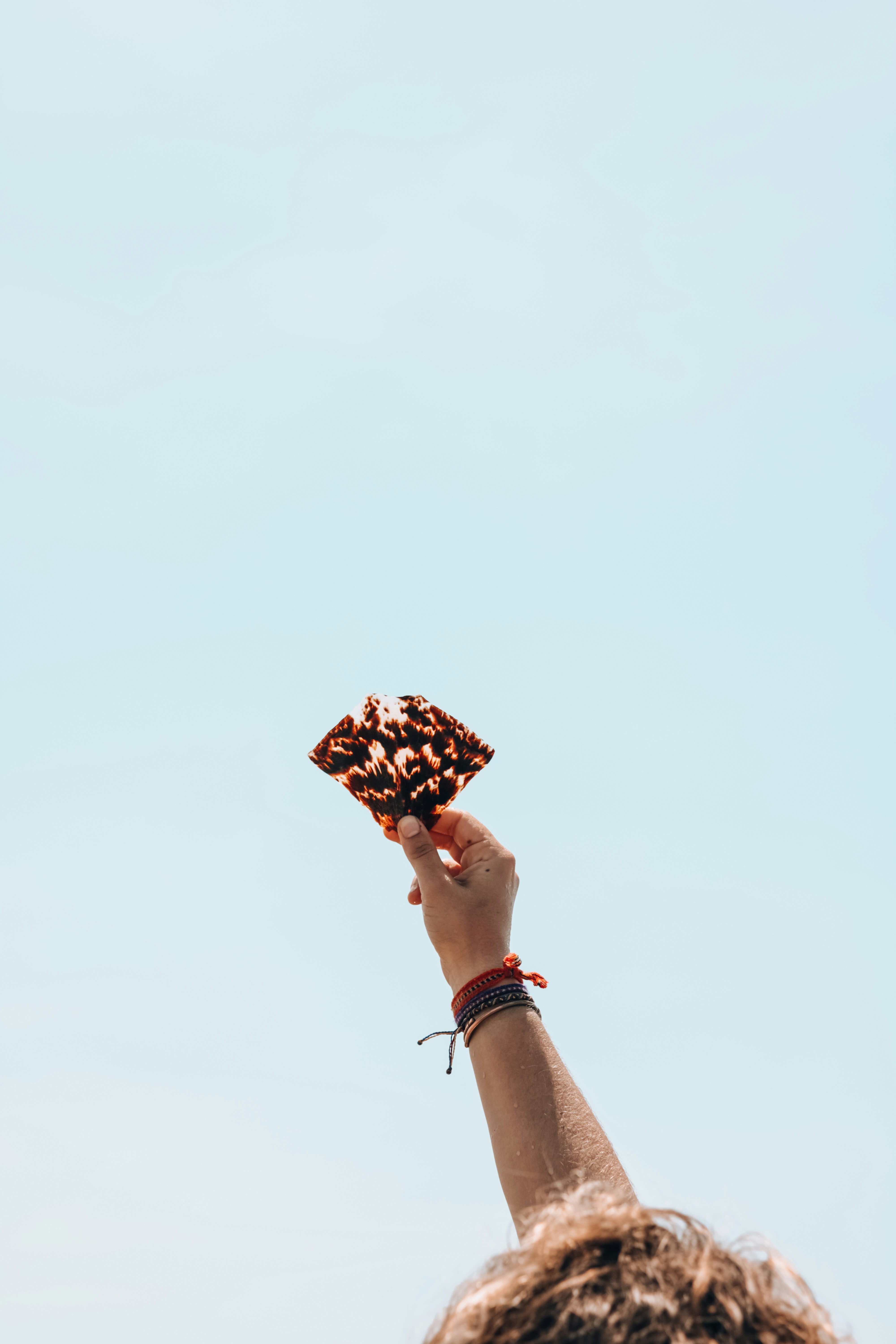 Raised Flame: A Handful of Sparks Against an Open Sky