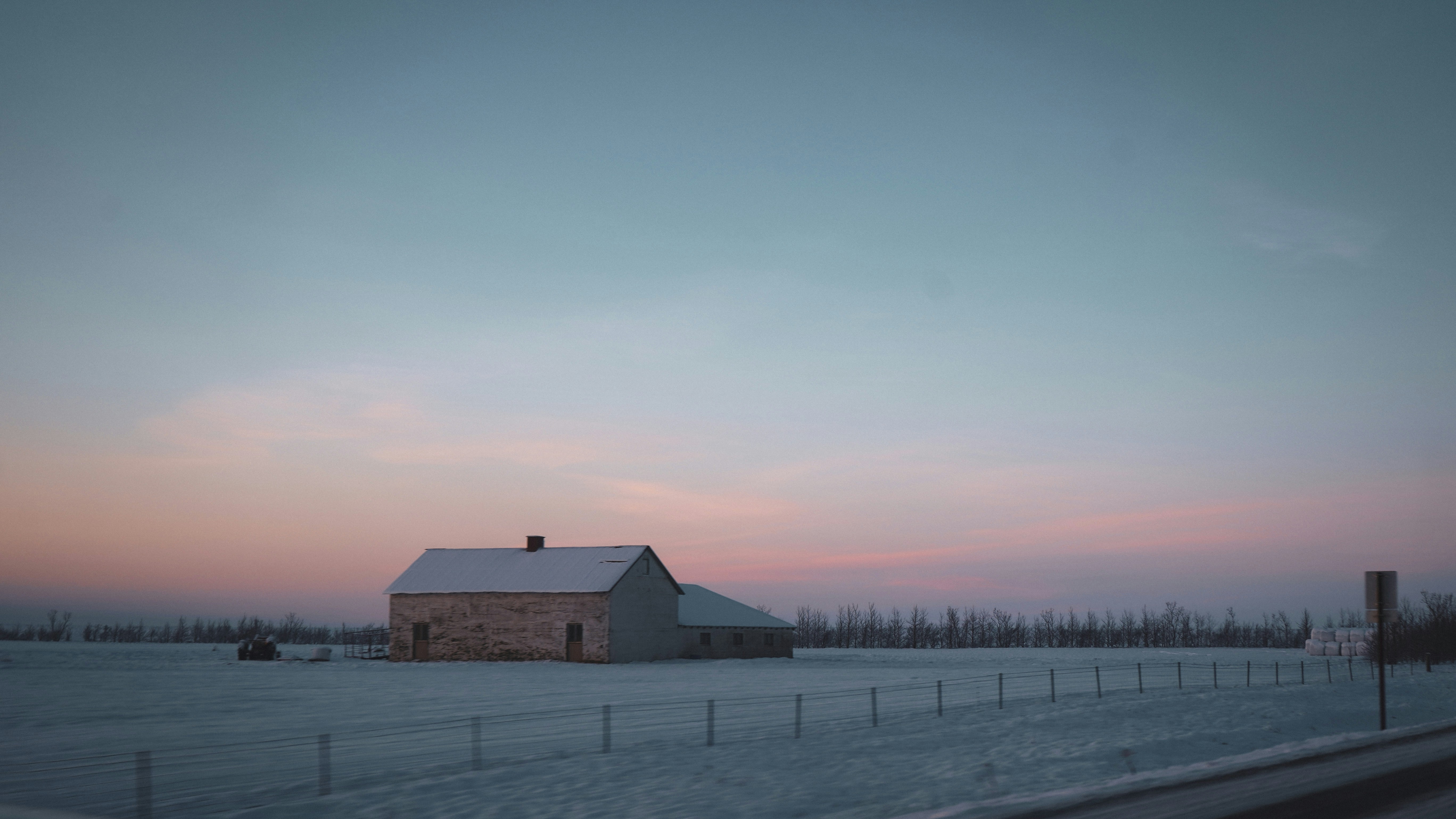 Pastel Dusk Over a Snowbound Barn