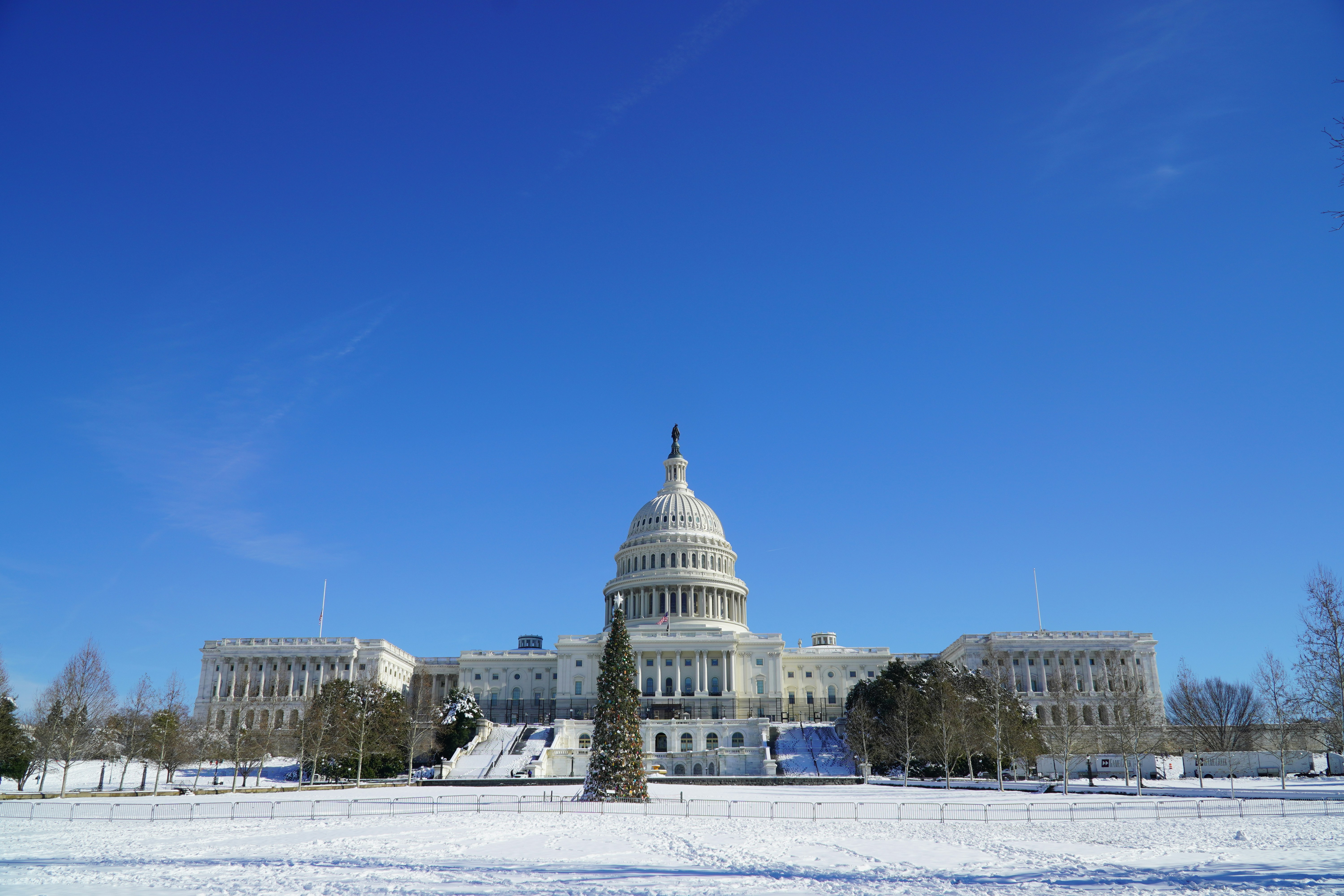 The capitol building in winter with snow on the ground photo – Free ...