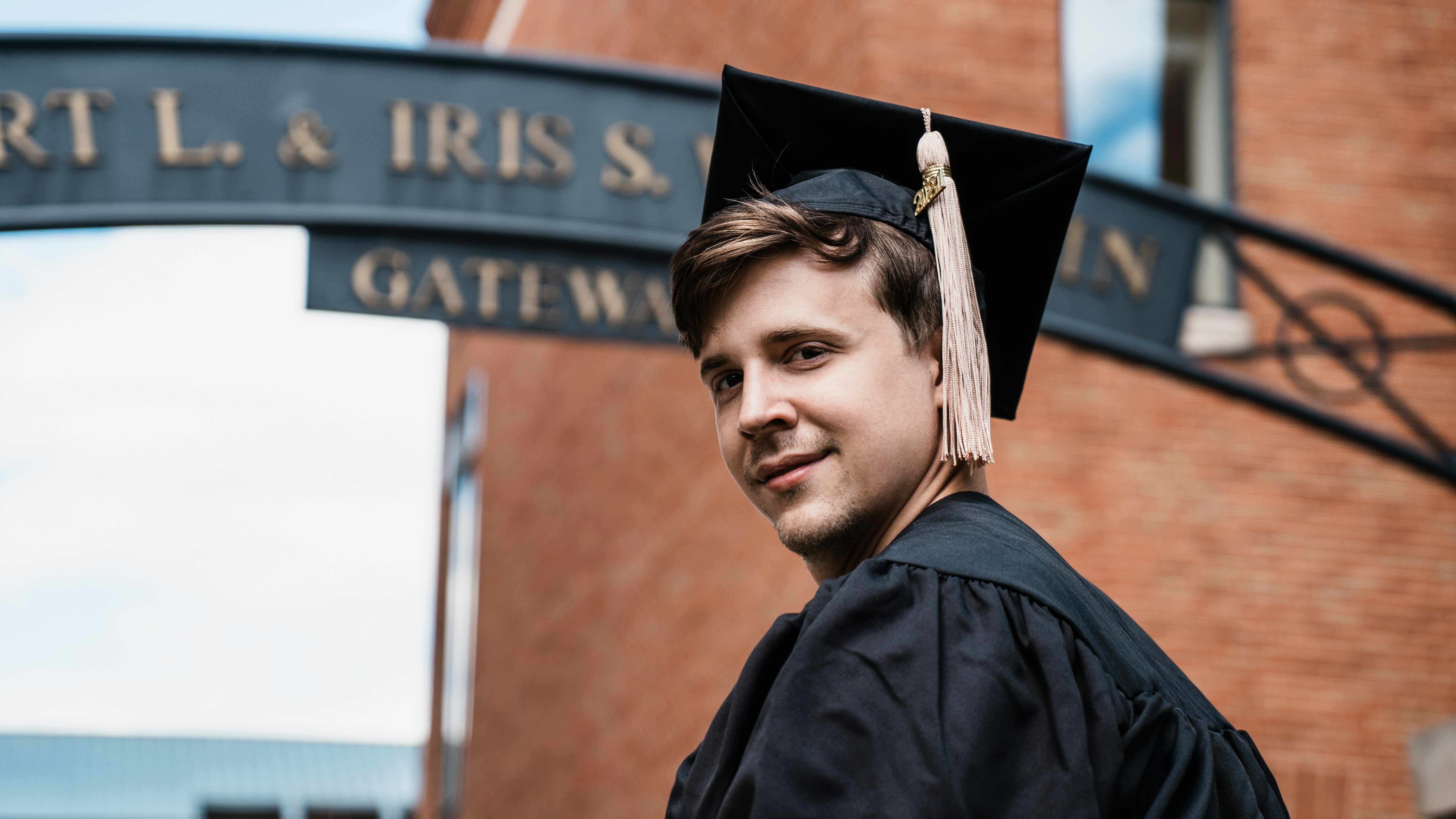 A man in a graduation cap and gown photo – Free Human Image on Unsplash