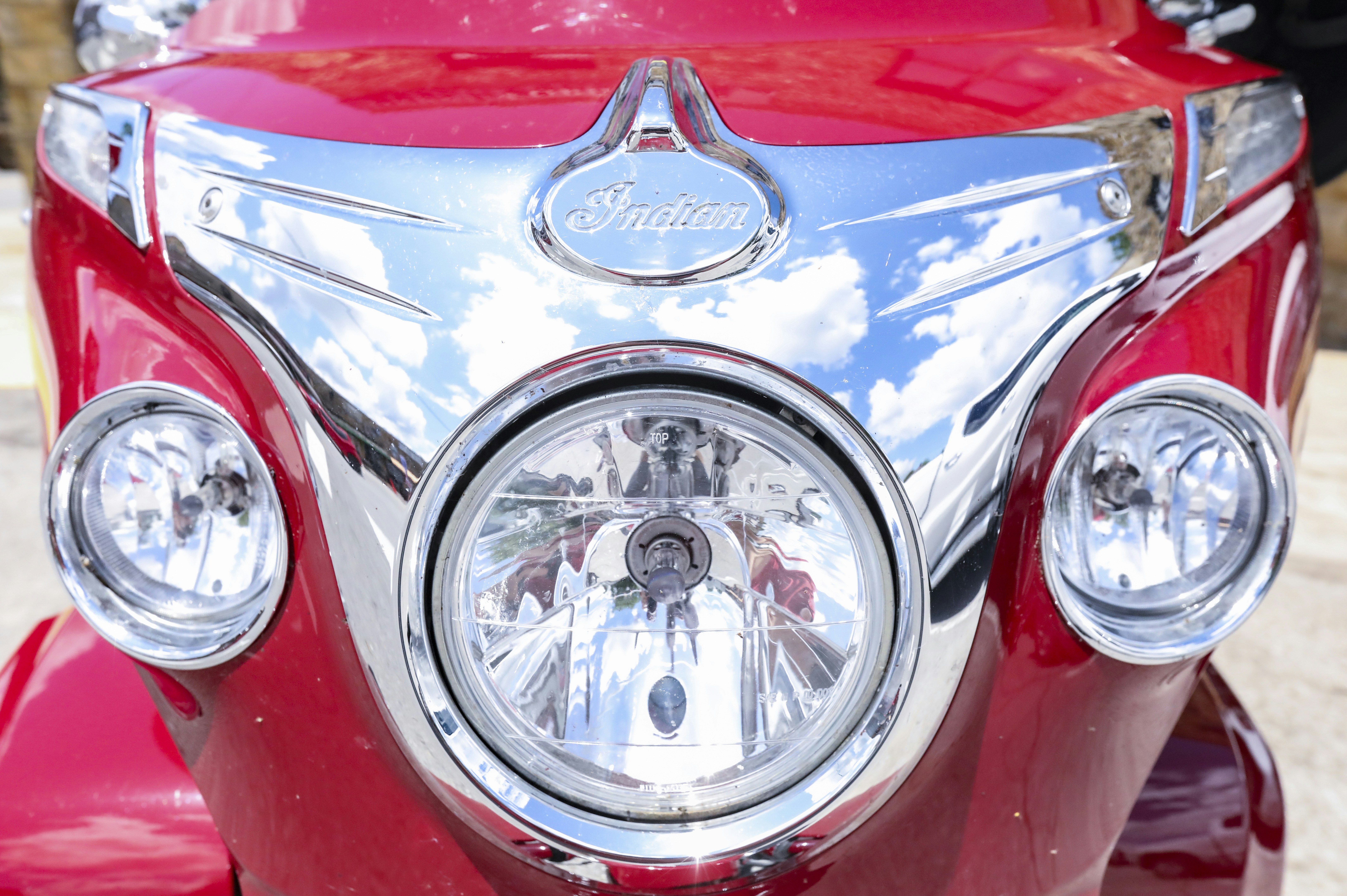 Chrome Heartbeat: Front-and-Center of a Red Indian Motorcycle