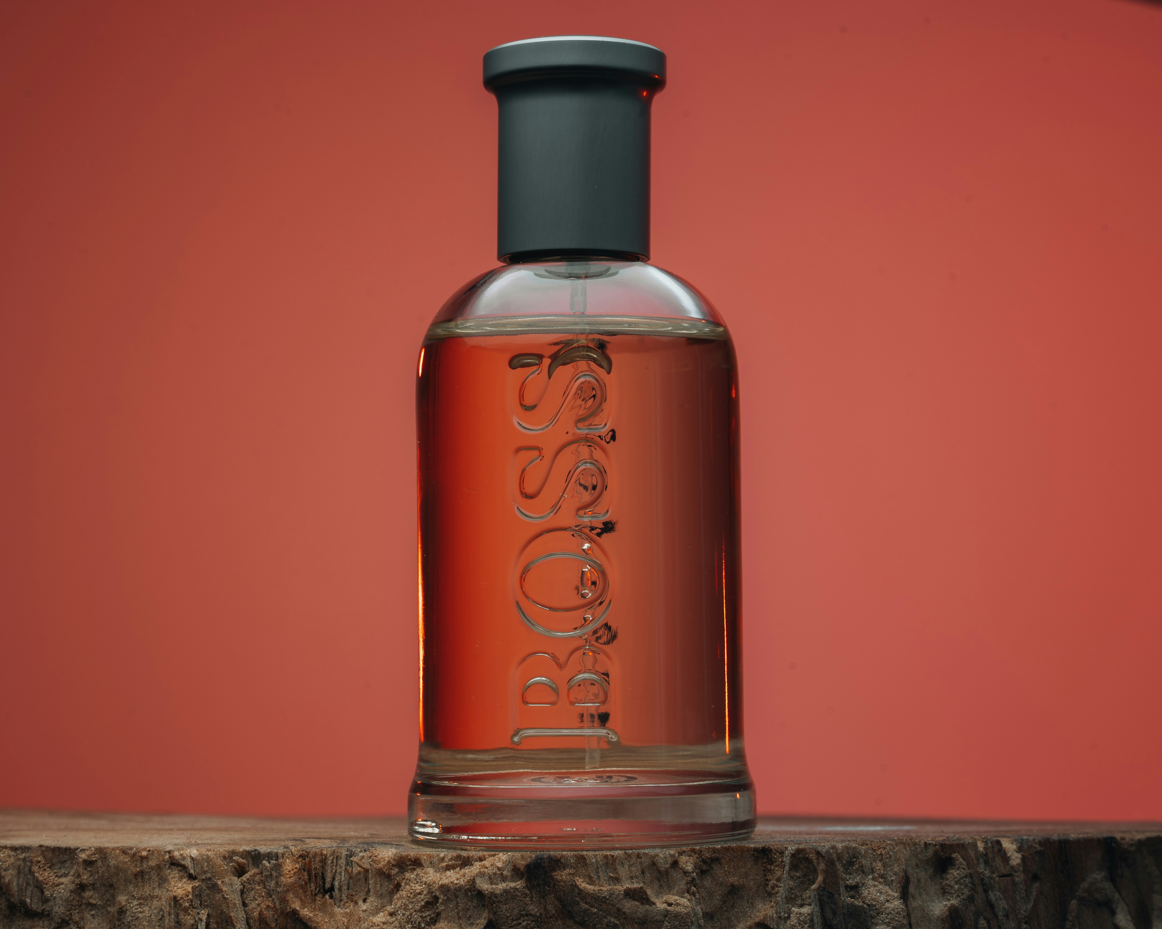 A bottle of booze sitting on top of a table photo – Free Products ...