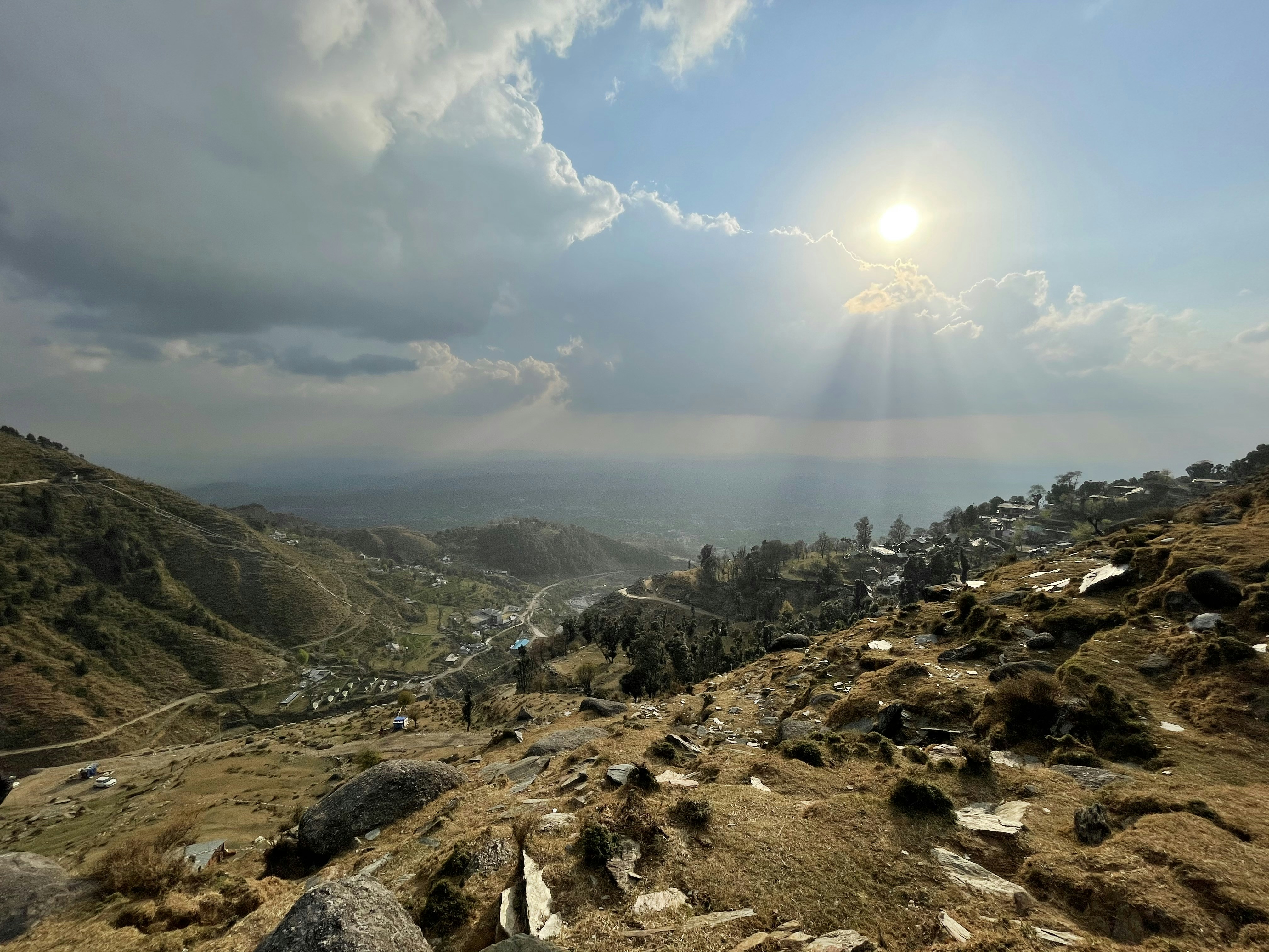 Sunlit Serenity Over Rolling Hills