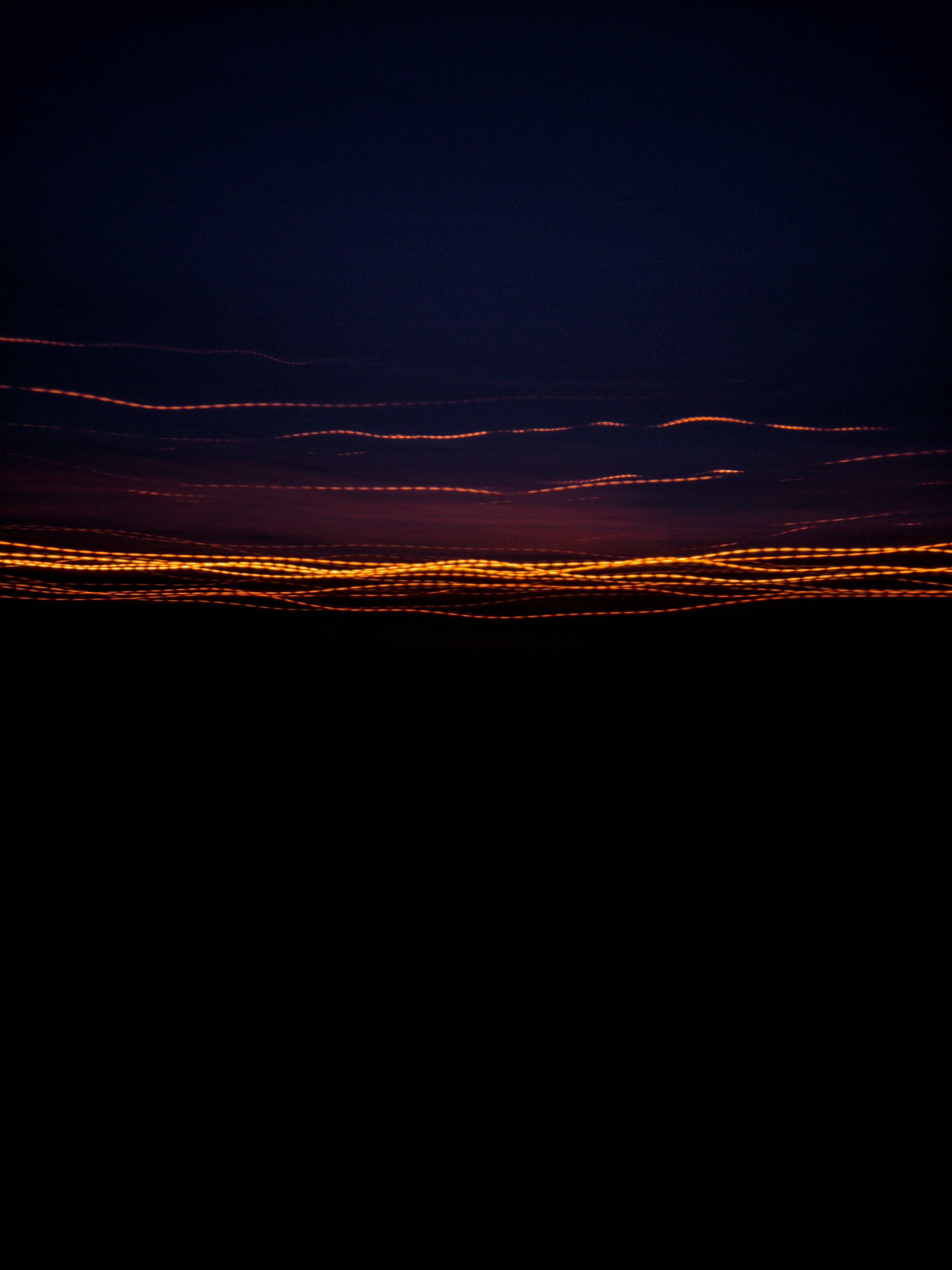 a plane flying in the sky at night