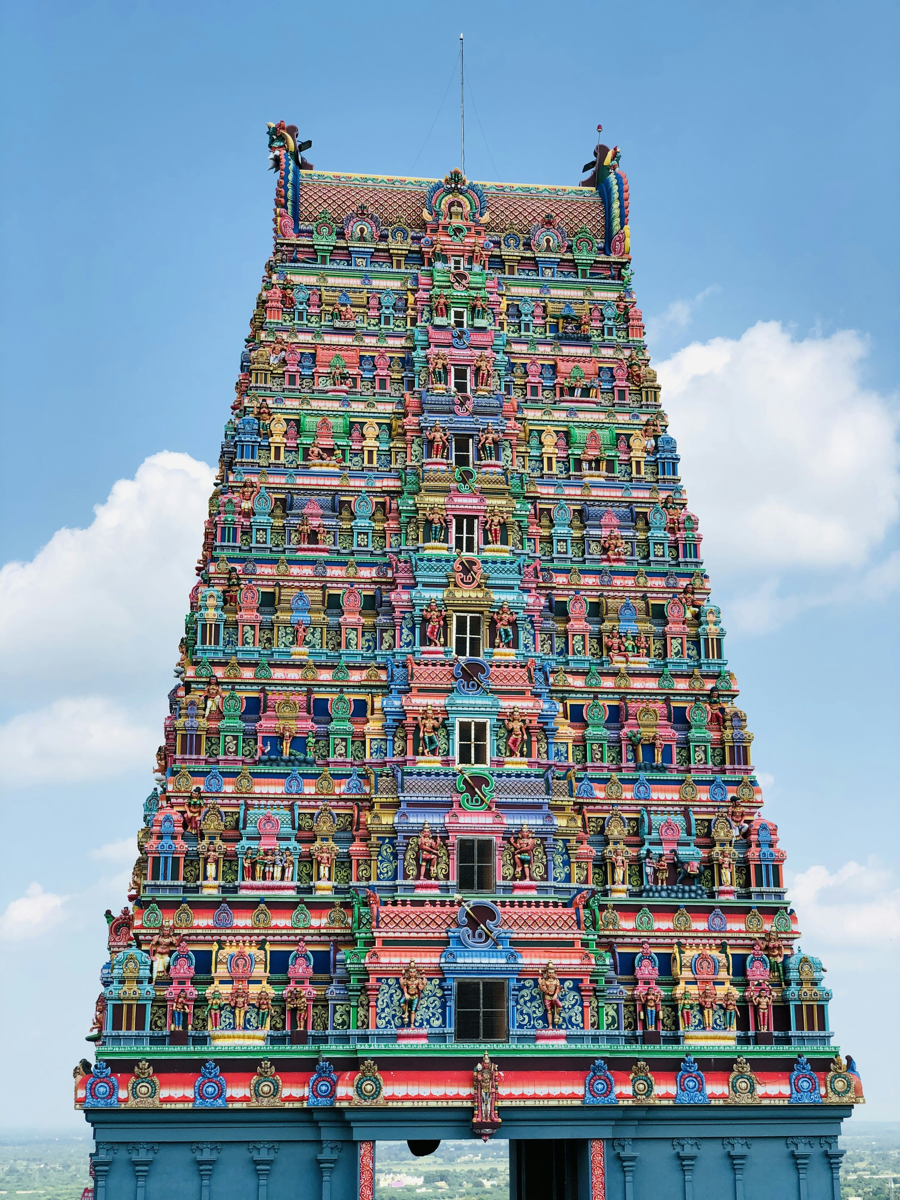 A very tall colorful building with a sky background photo – Free ...