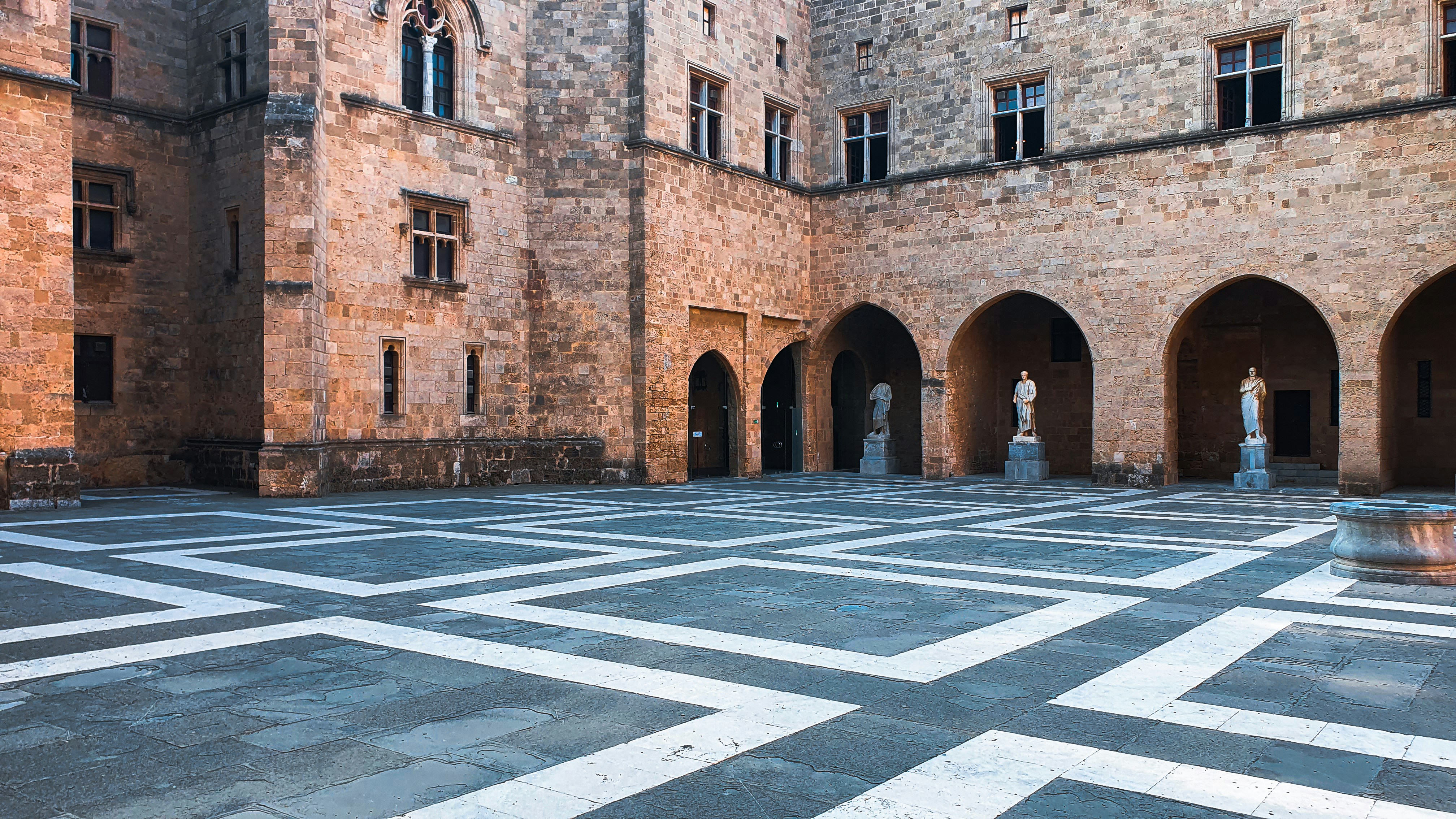 Stone Courtyard Mosaic: Geometry and Arcades