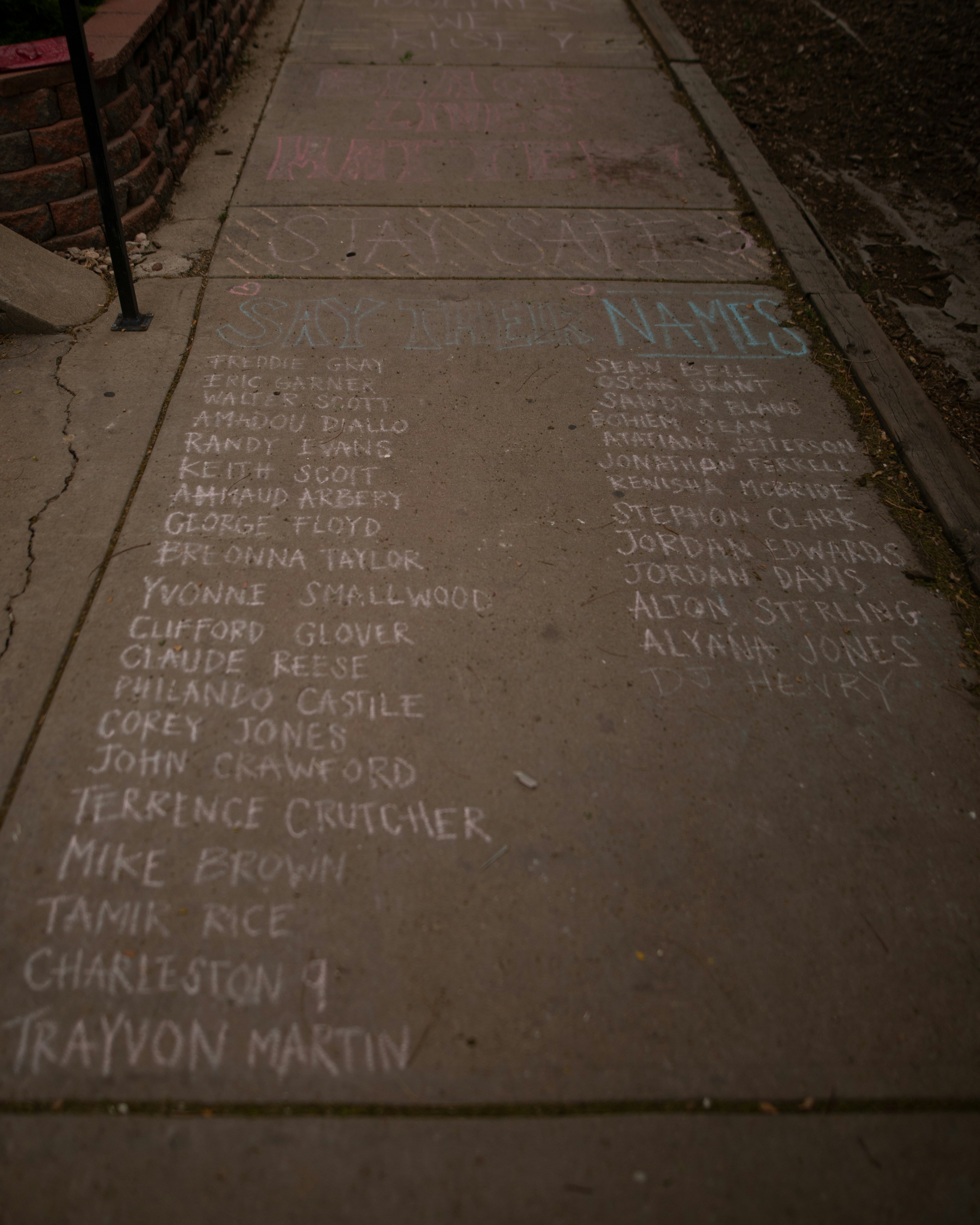 A sidewalk with chalk writing on it photo – Free Current events Image ...