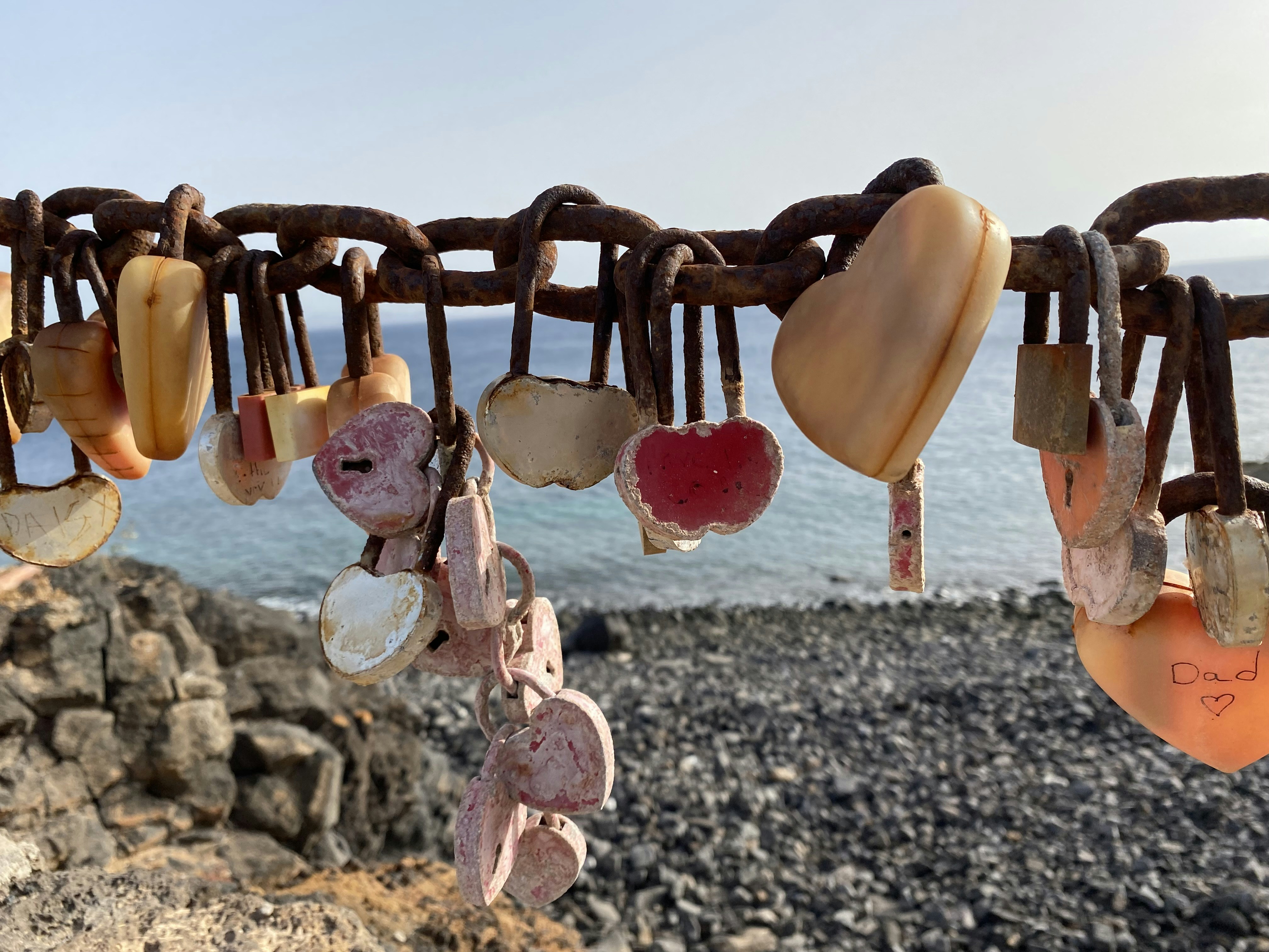 a bunch of sea glass hanging from a rope
