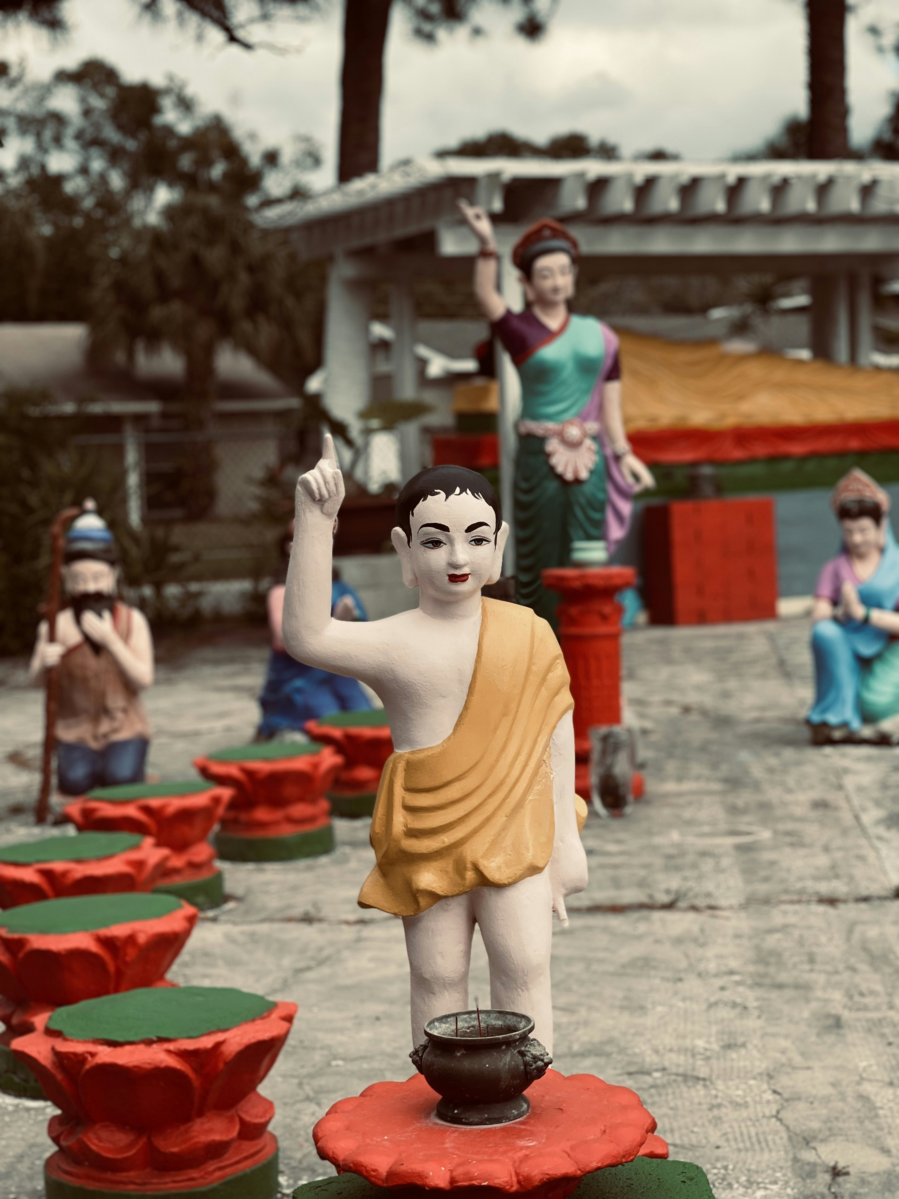 A statue of a man with a pot on his head photo – Free Person Image on ...