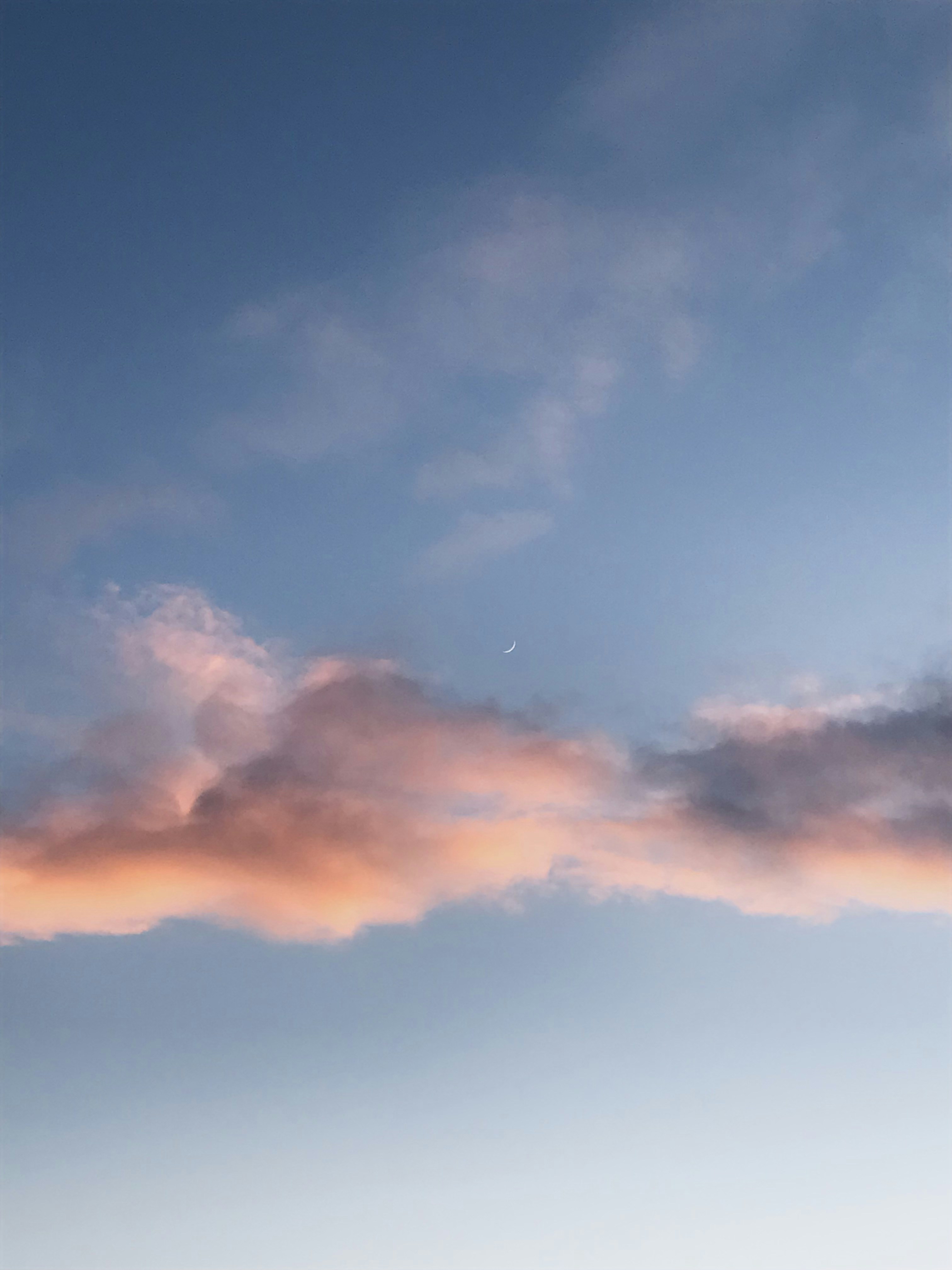 a group of people standing on a beach under a cloudy skyKimia Khoubani