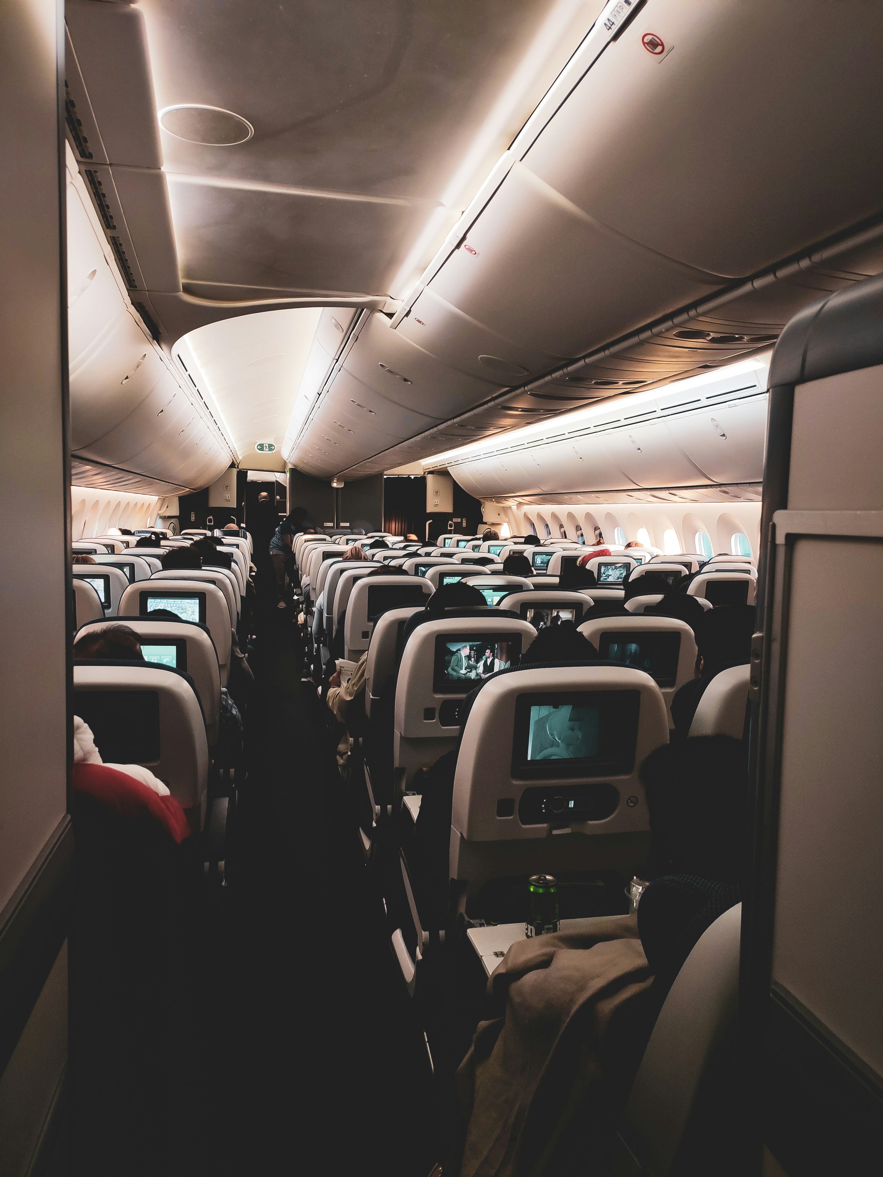 The inside of an airplane with rows of seats photo – Free Airoplane ...