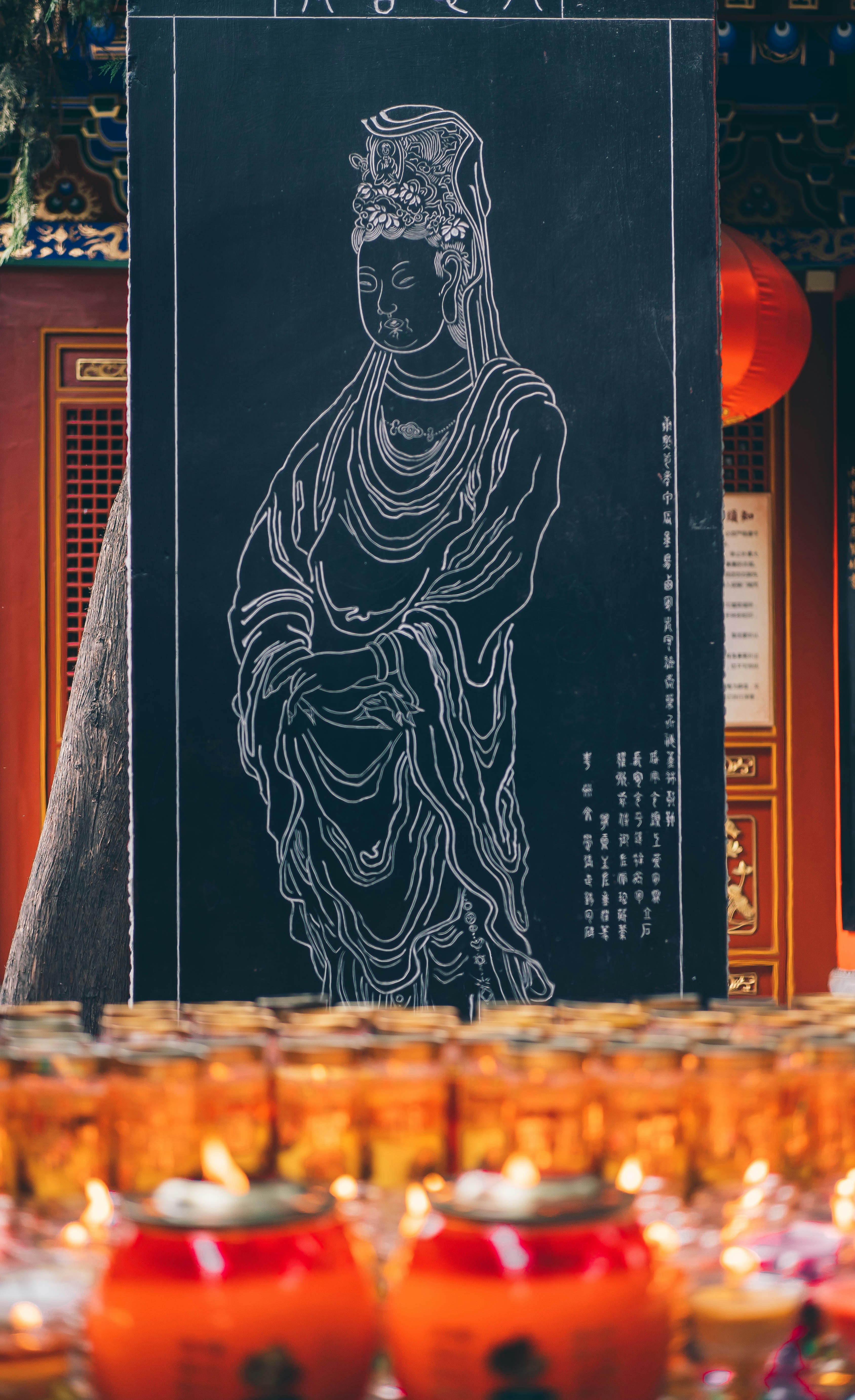 Chiseled Silhouette: A Sacred Figure Framed by Vibrant Vessels