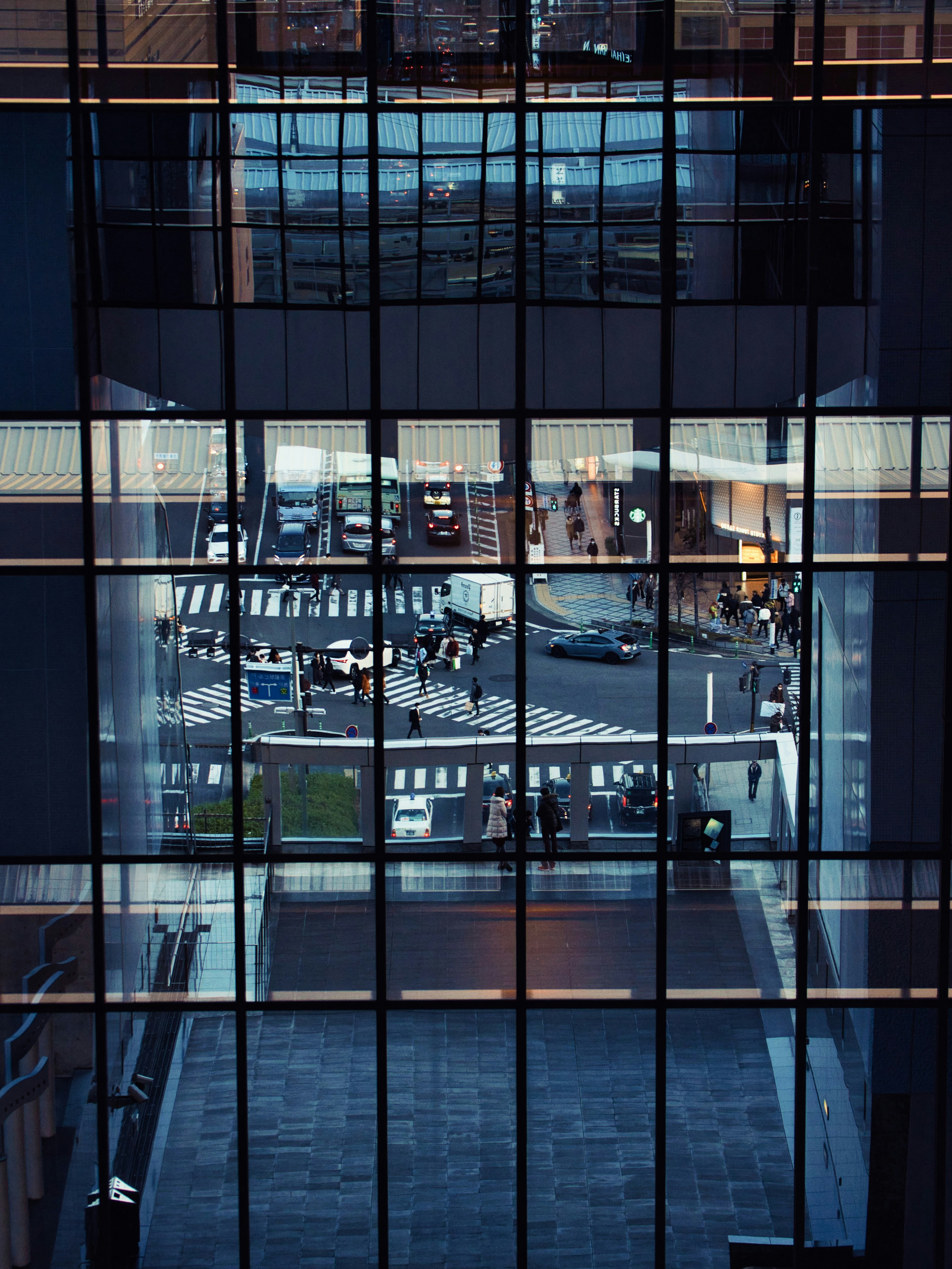 A view of a city from a high rise window photo – Free Grey Image on ...