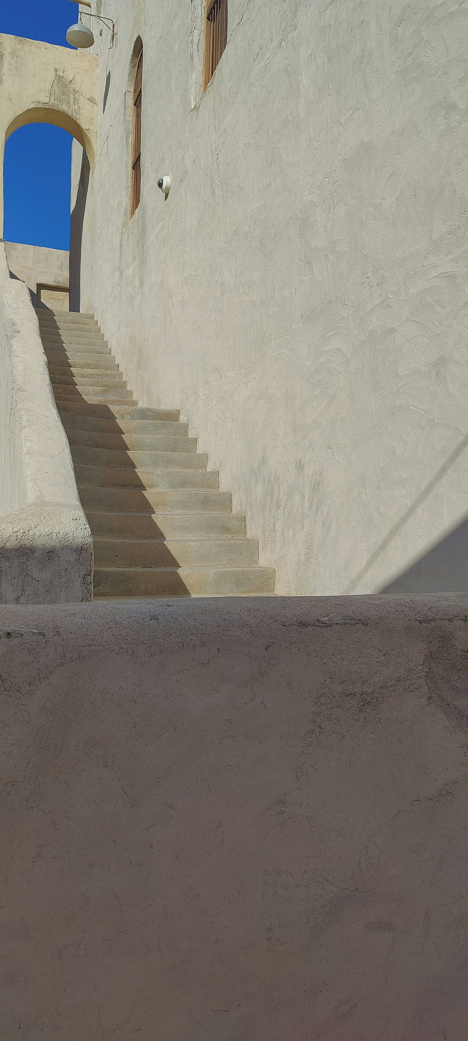 A man riding a skateboard down a flight of stairs photo – Free Banister ...
