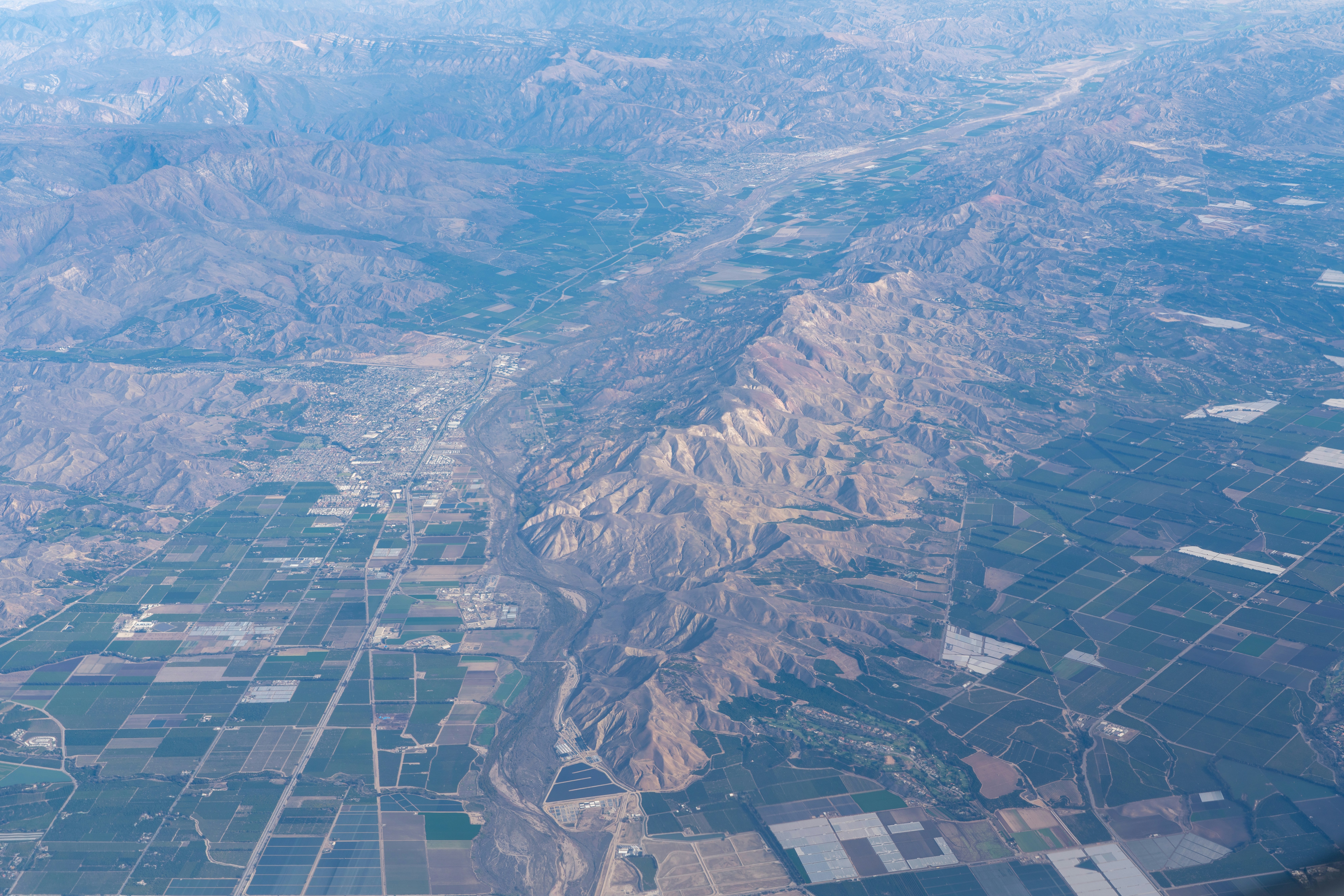Blue-Ridge Loom: Aerial View of Mountain Crest Over Patchwork Valley