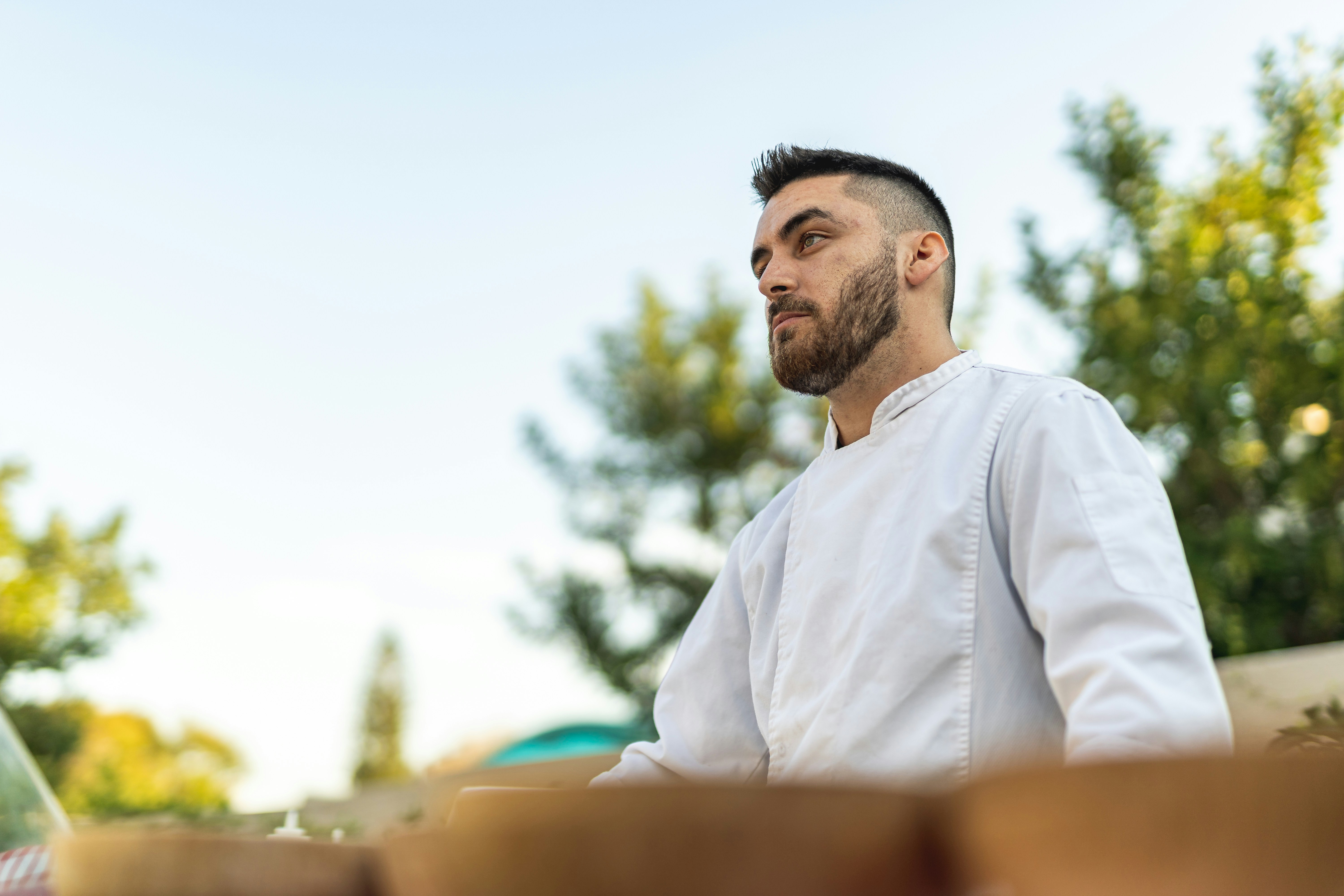 Portrait in White: Quiet Confidence Under Open Sky