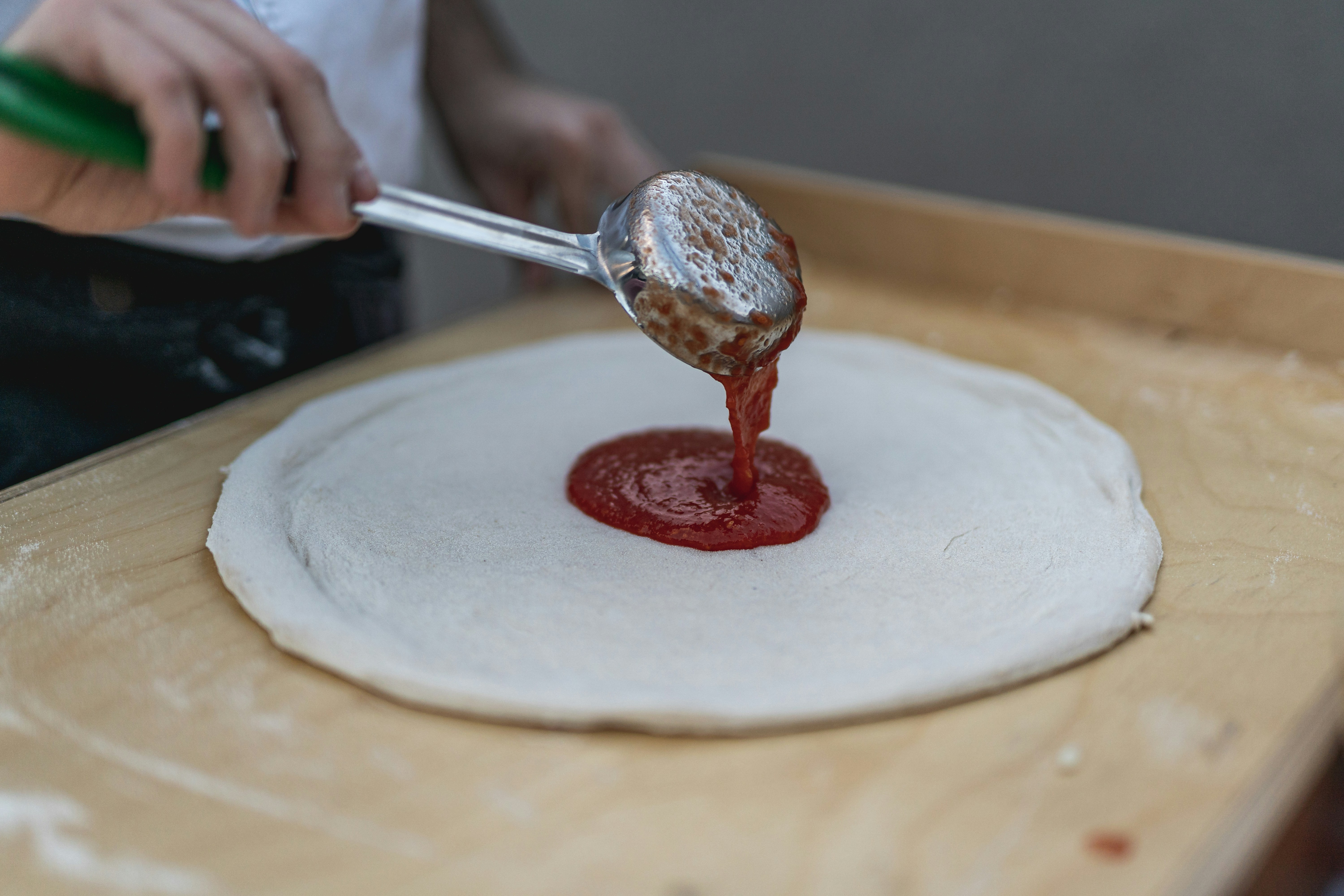A person is making something with a spoon photo – Free Food Image on ...