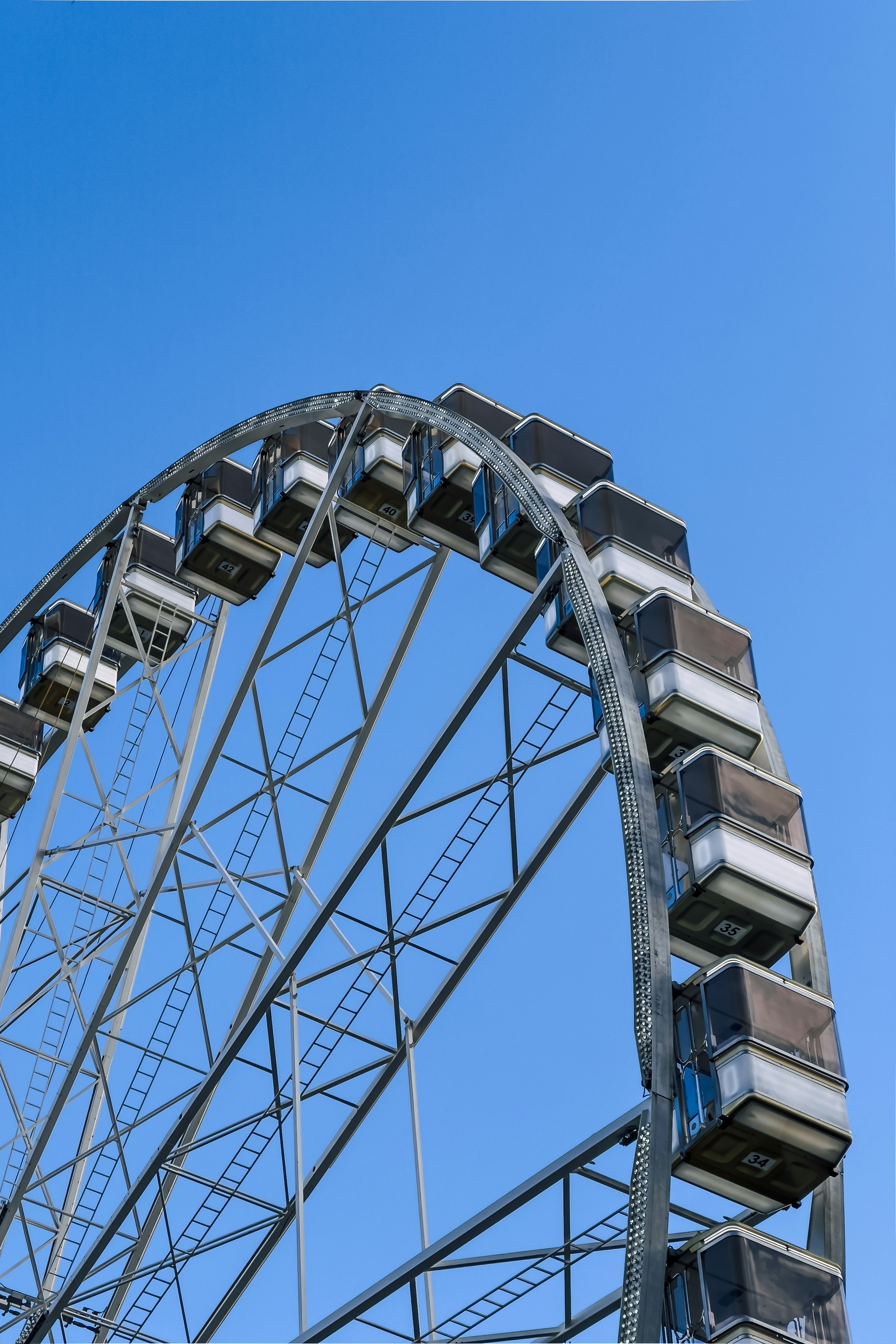 a roller coaster with a blue sky in the background
