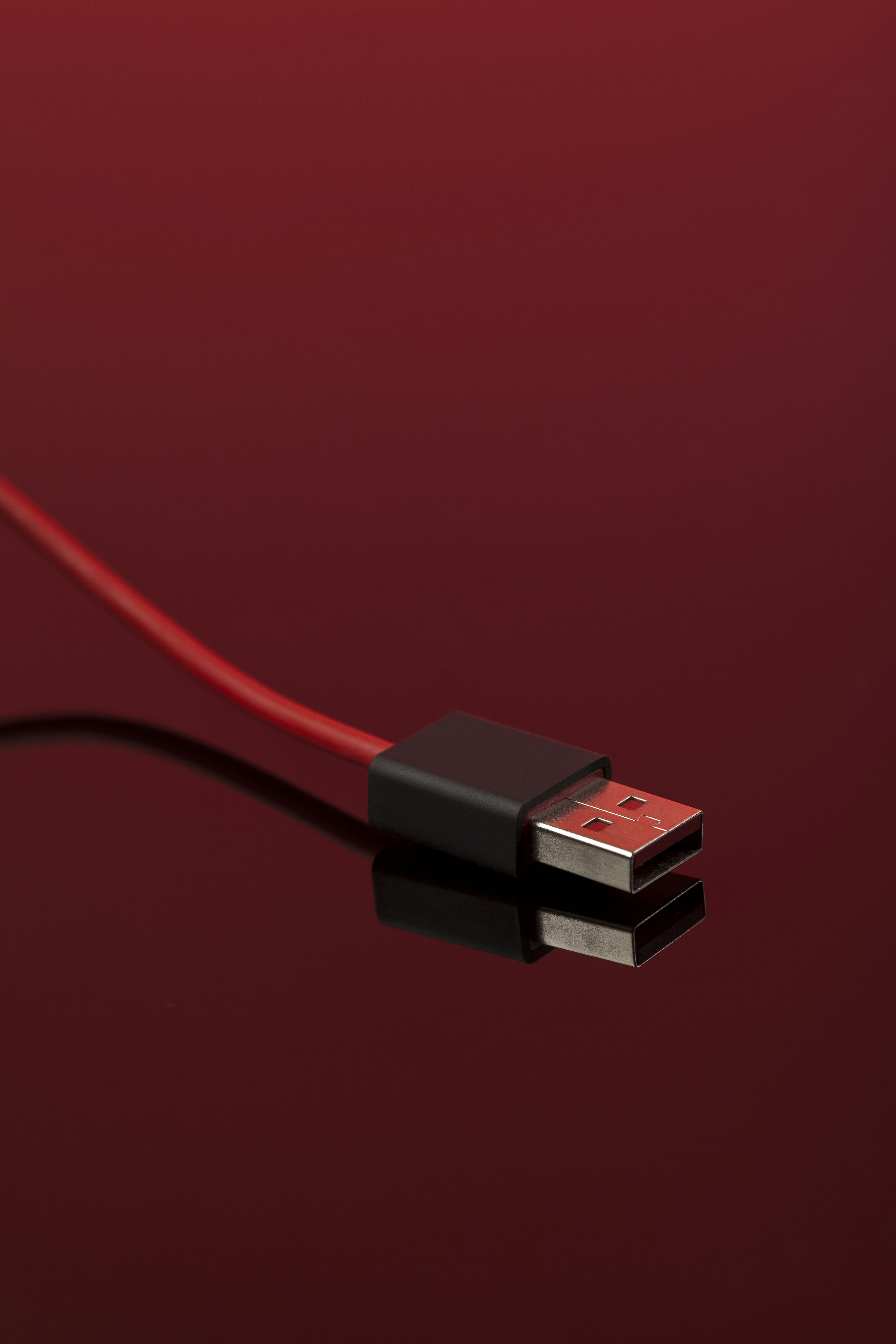 A close up of a red and black cable photo – Free Cable Image on Unsplash