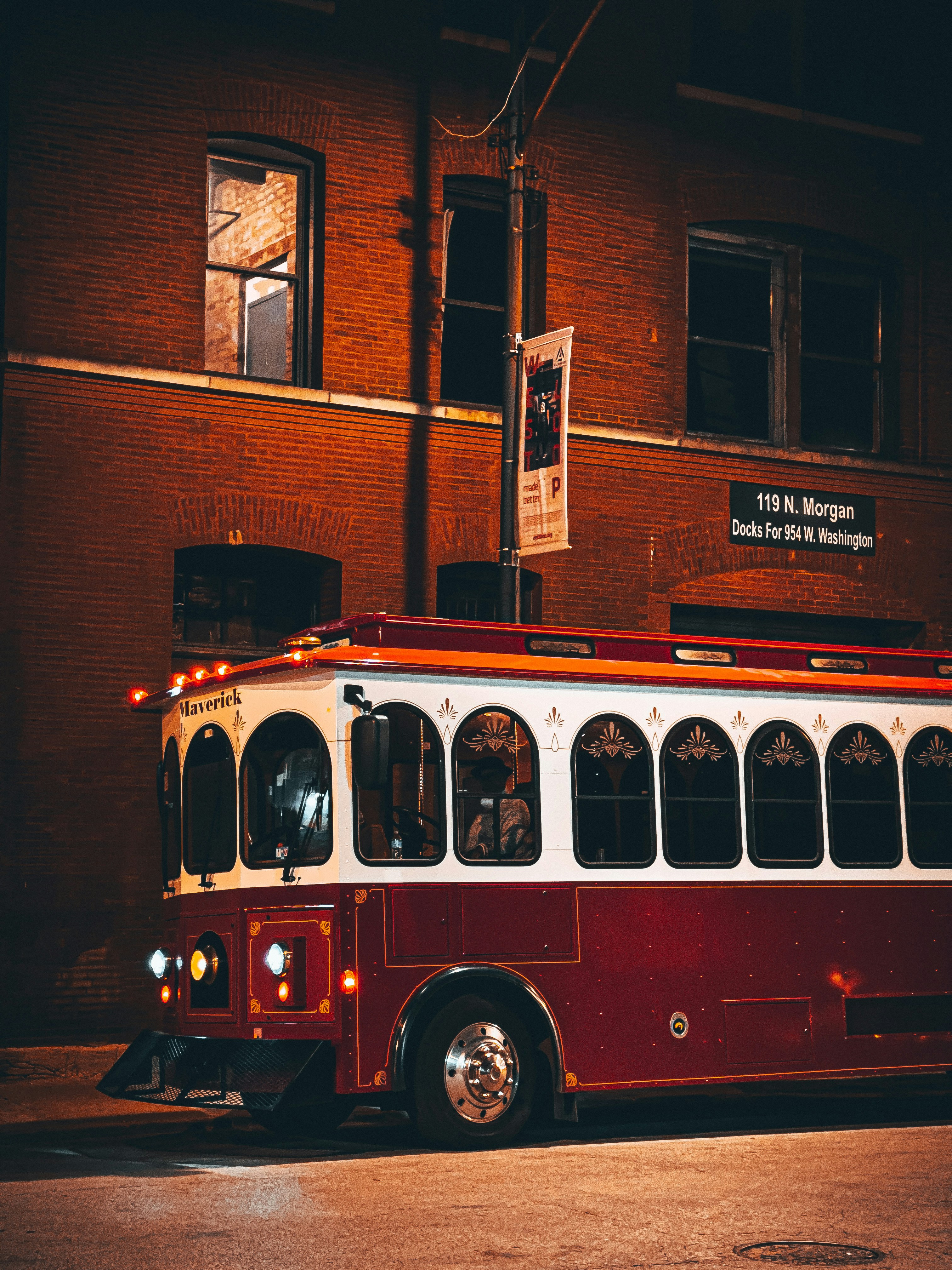 Evening Run: Red Trolley Against Brick Facades