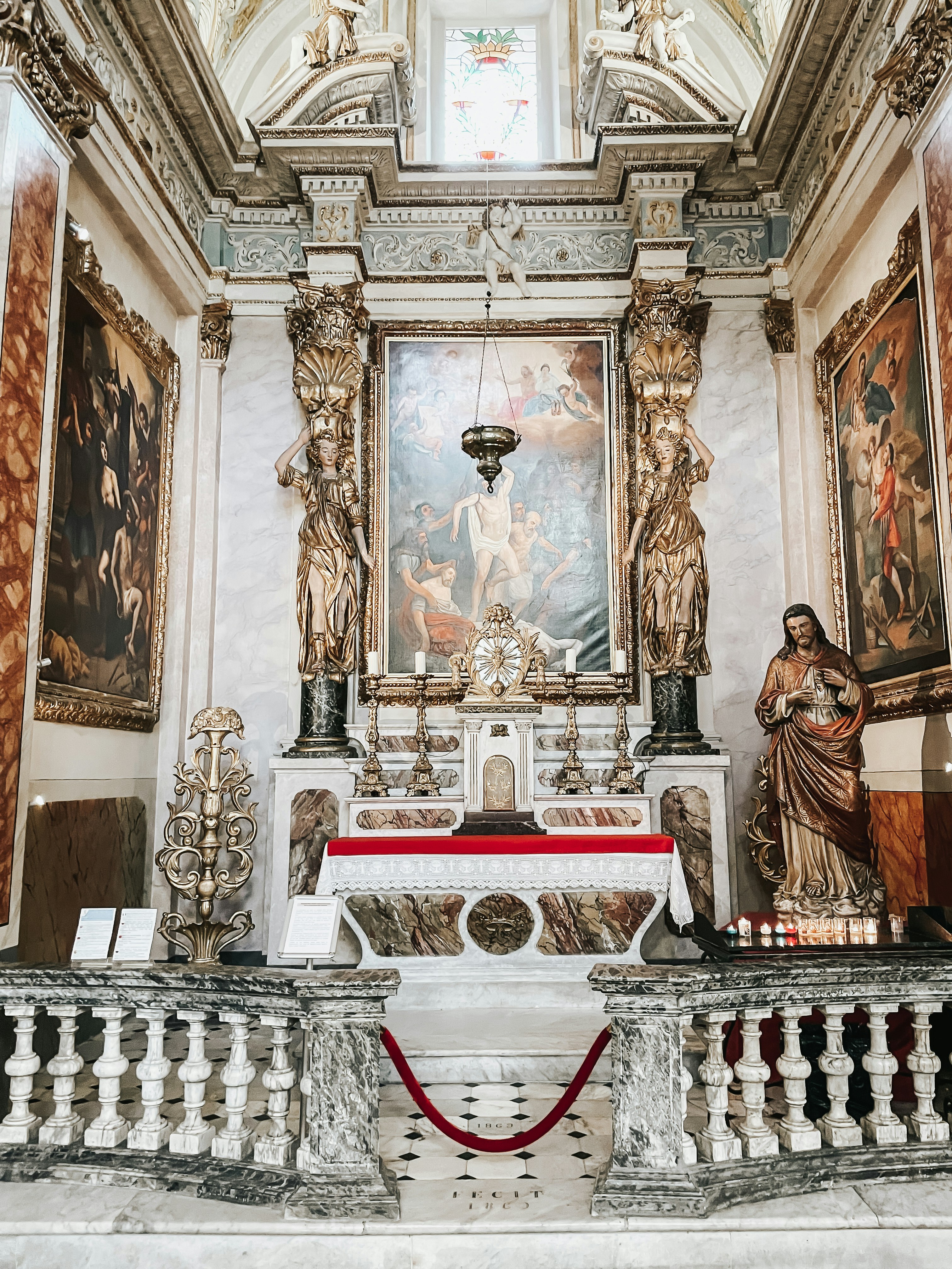 A church with statues and paintings on the walls photo – Free Building ...