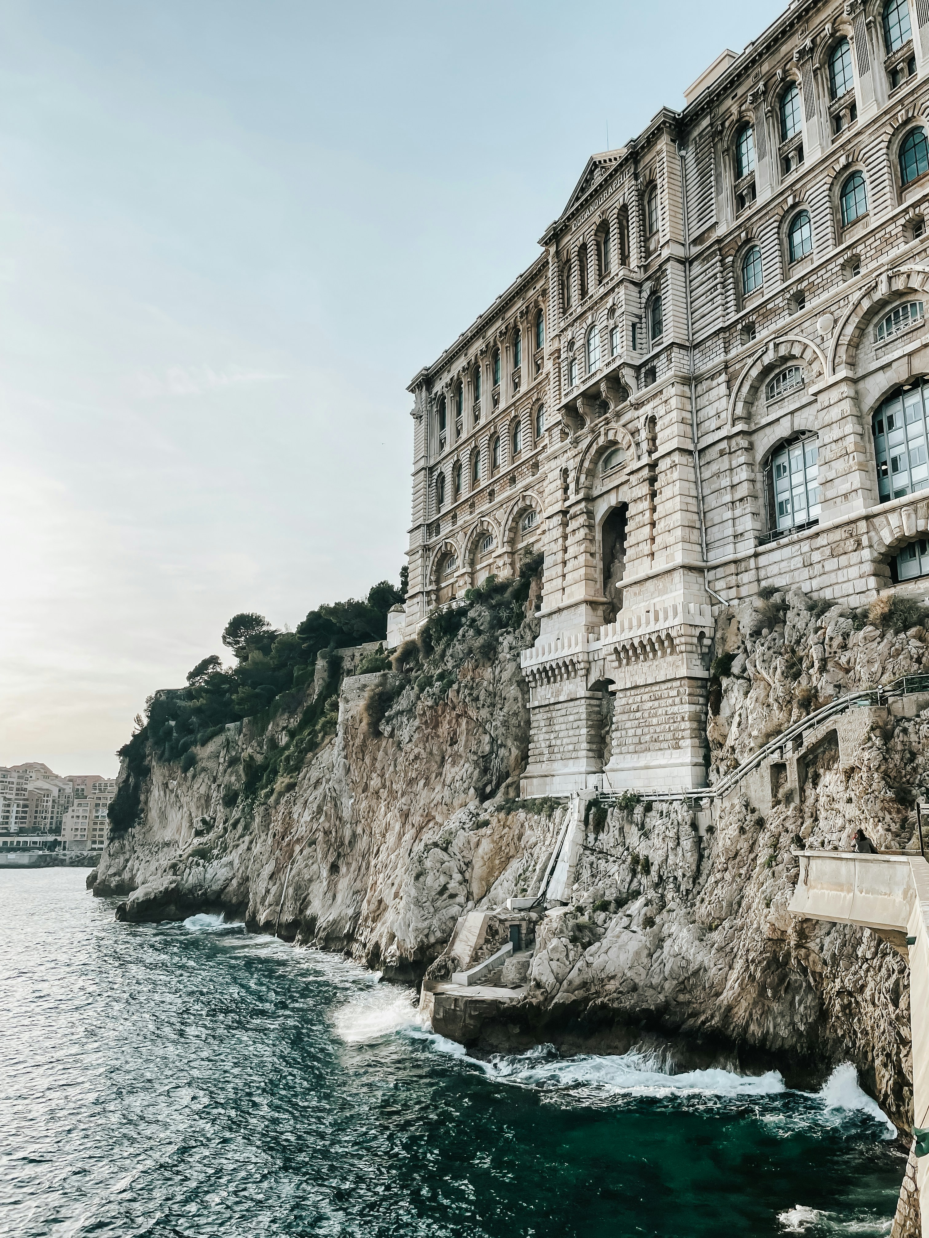 Harbor Terrace: Stone Facade Clinging to Coastal Cliff