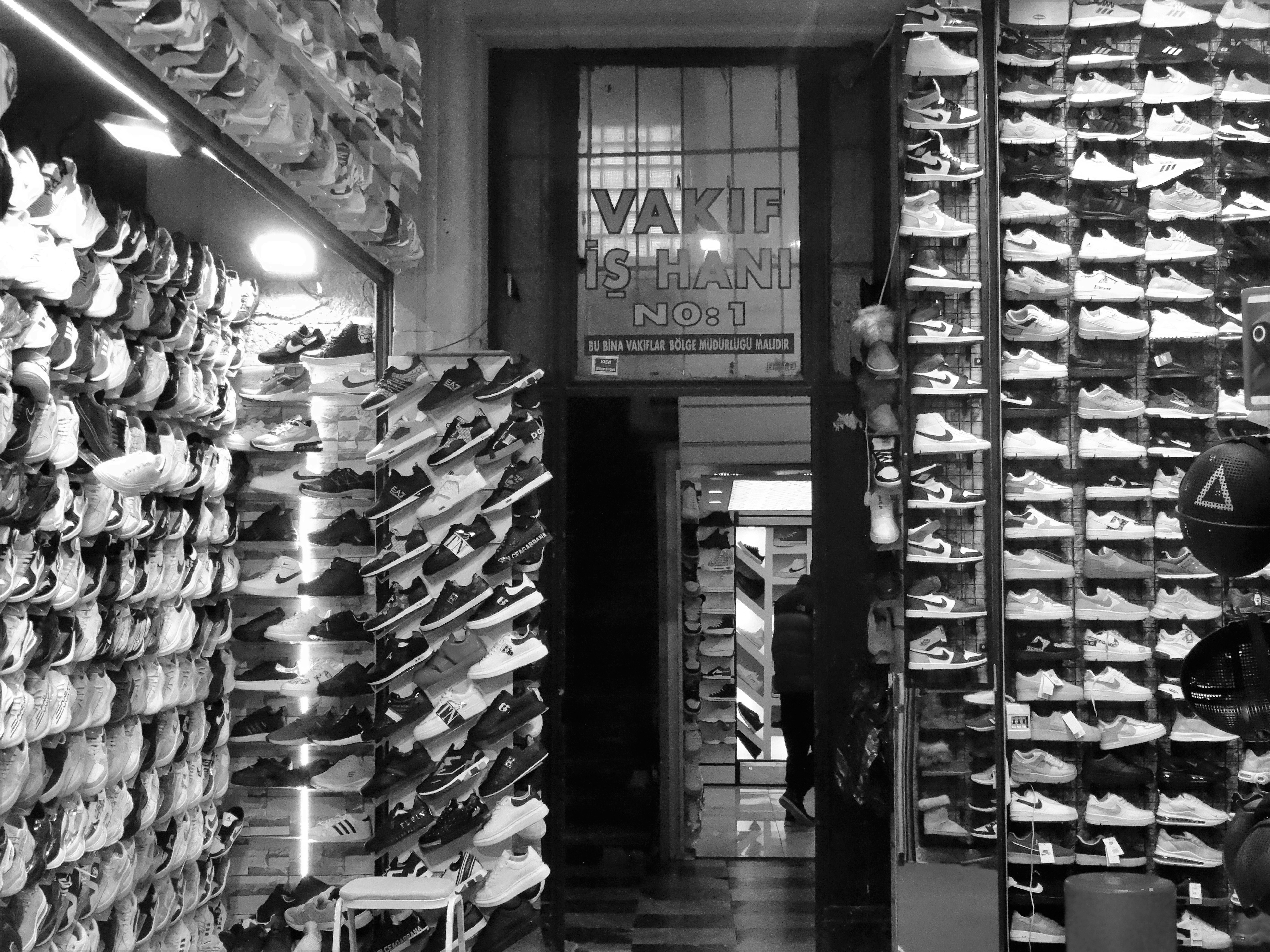 A black and white photo of a shoe store photo – Free Hobyar Image on ...