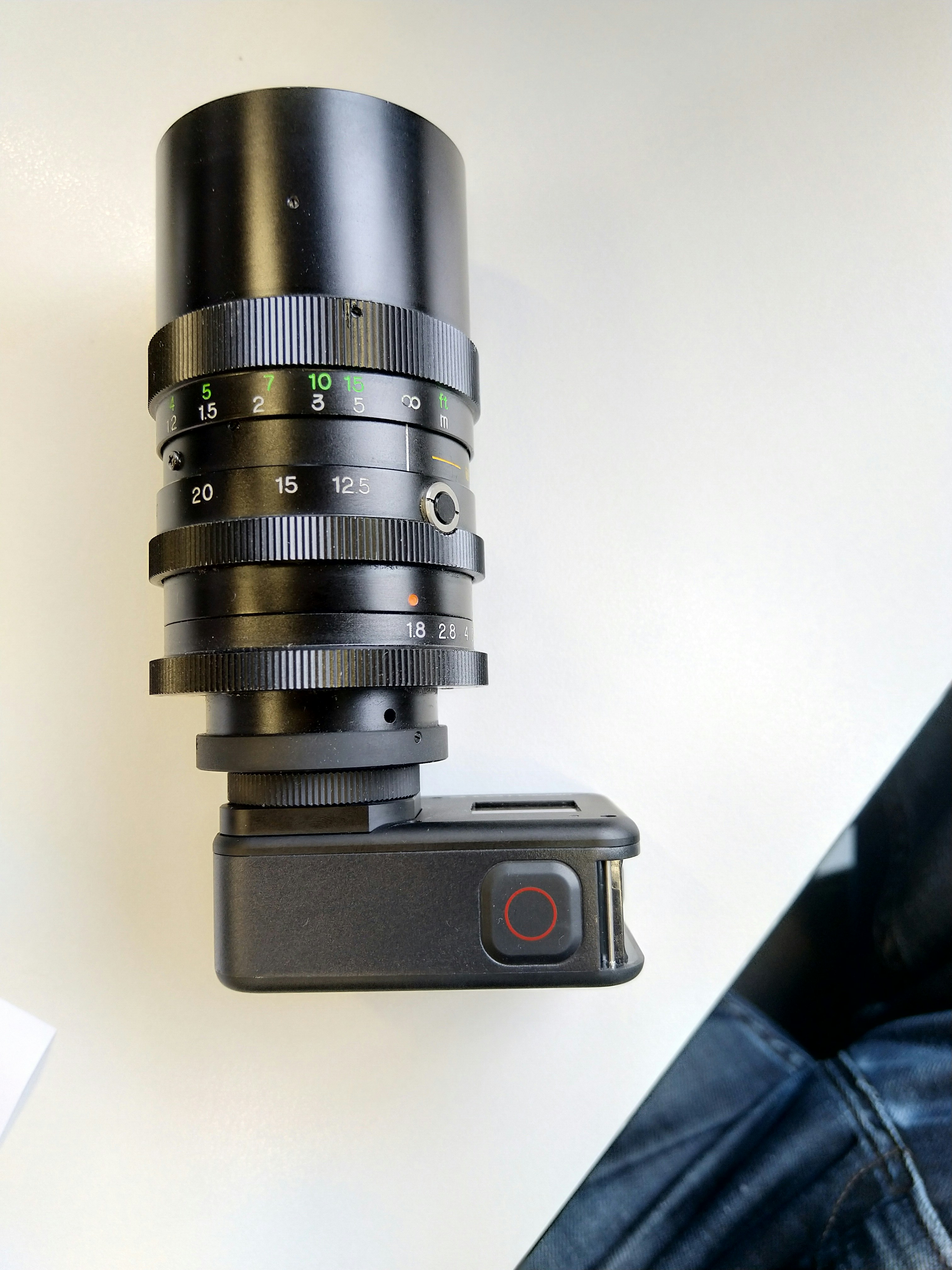 A camera attached to a wall with a lens attached to it photo – Free ...