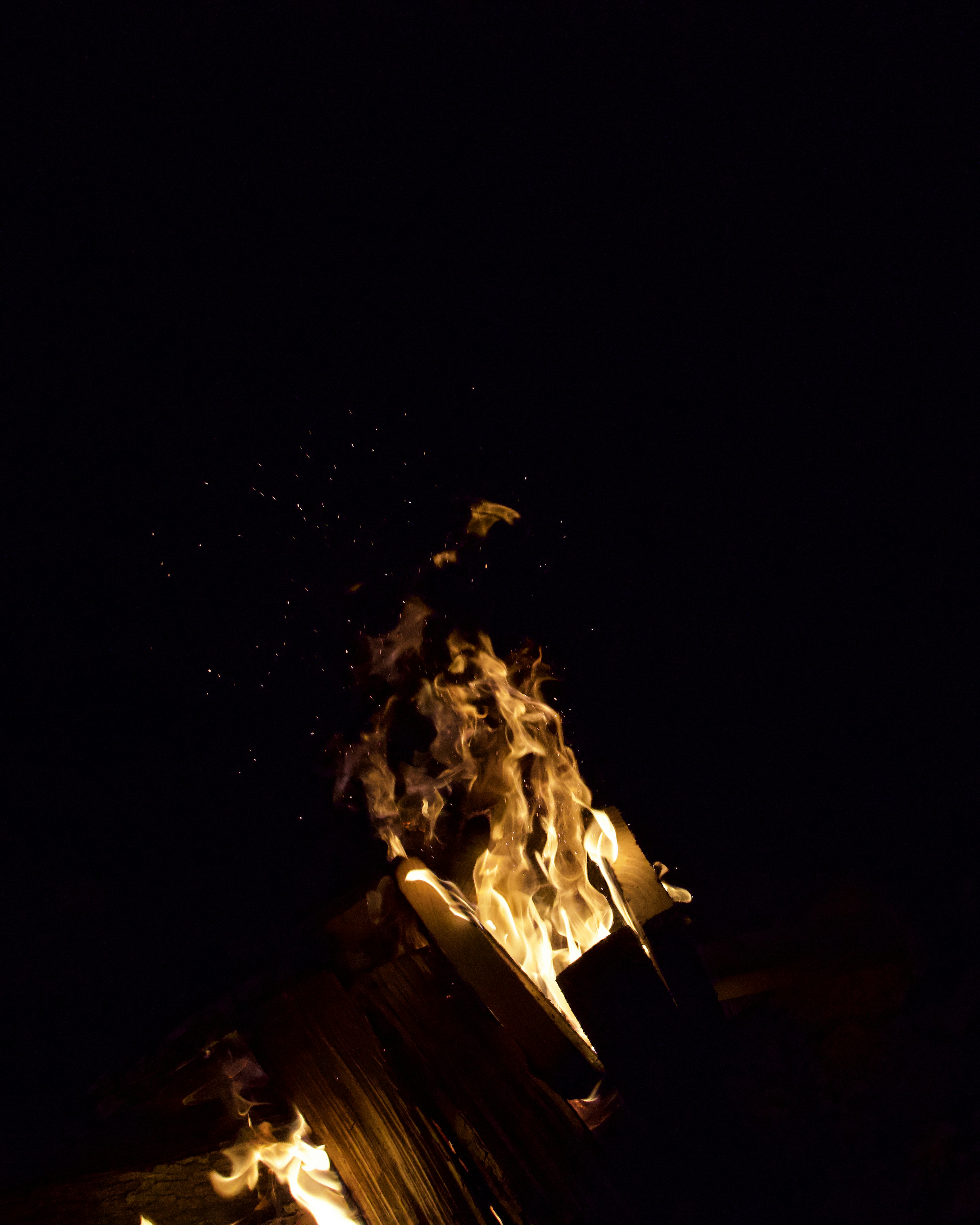 A fire is lit up in the dark photo – Free Fire Image on Unsplash