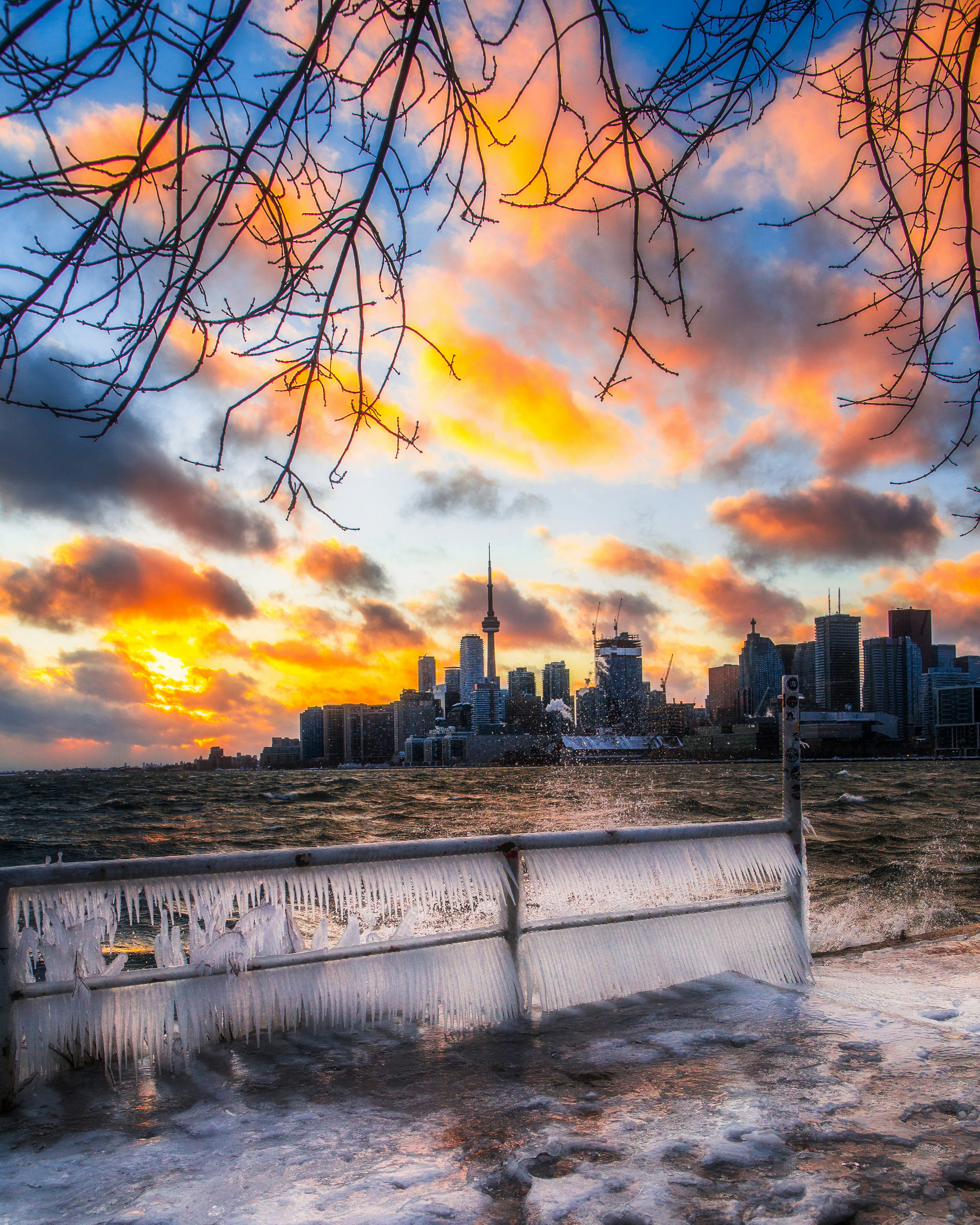 Dusk on the Frozen Waterfront: Icy Rail Meets Skyline