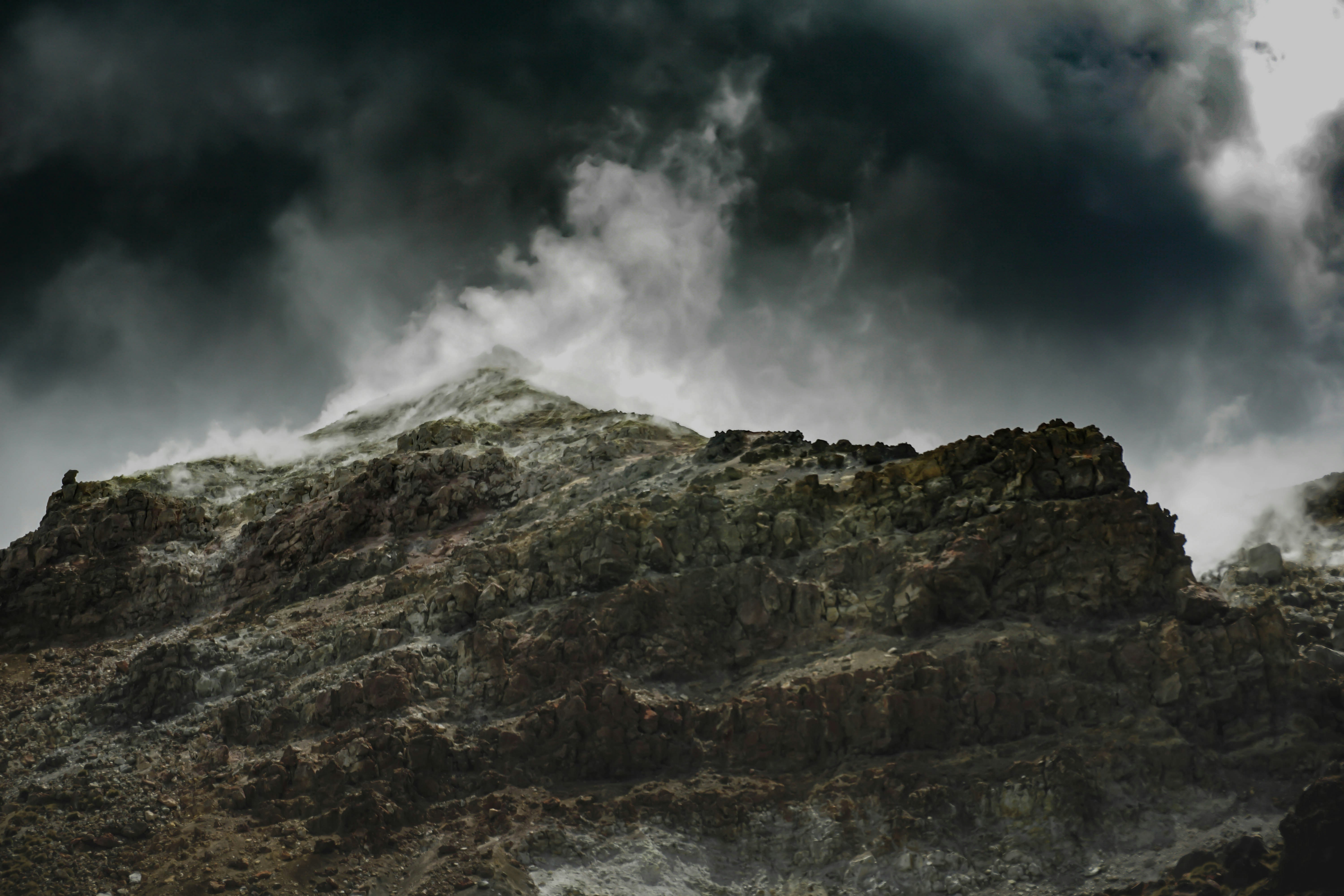 Storm-locked Peak: A Rugged Cliff Shrouded in Mist