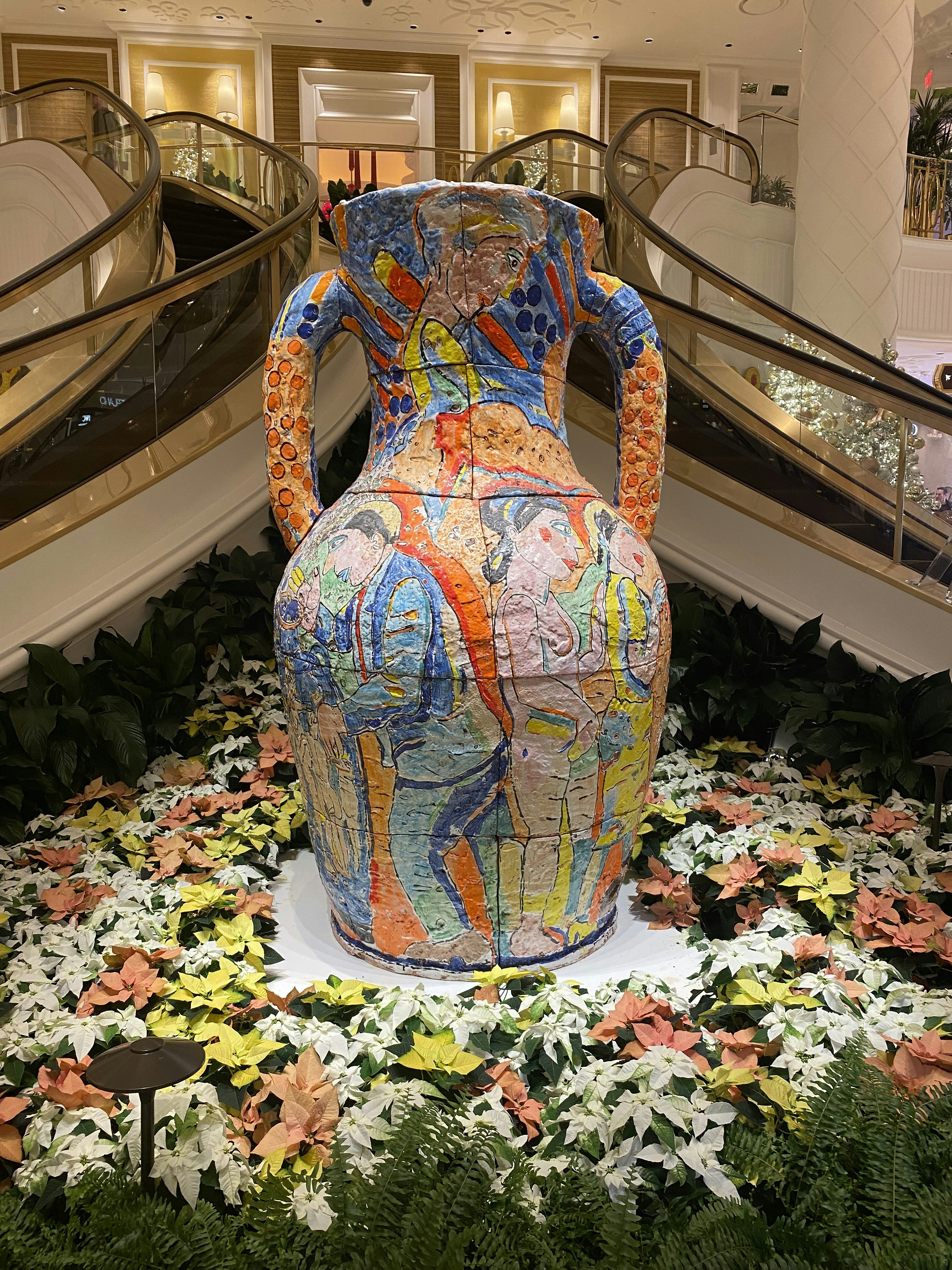 Vivid Mosaic Amphora Surrounded by a Petal Carpet in an Upscale Atrium
