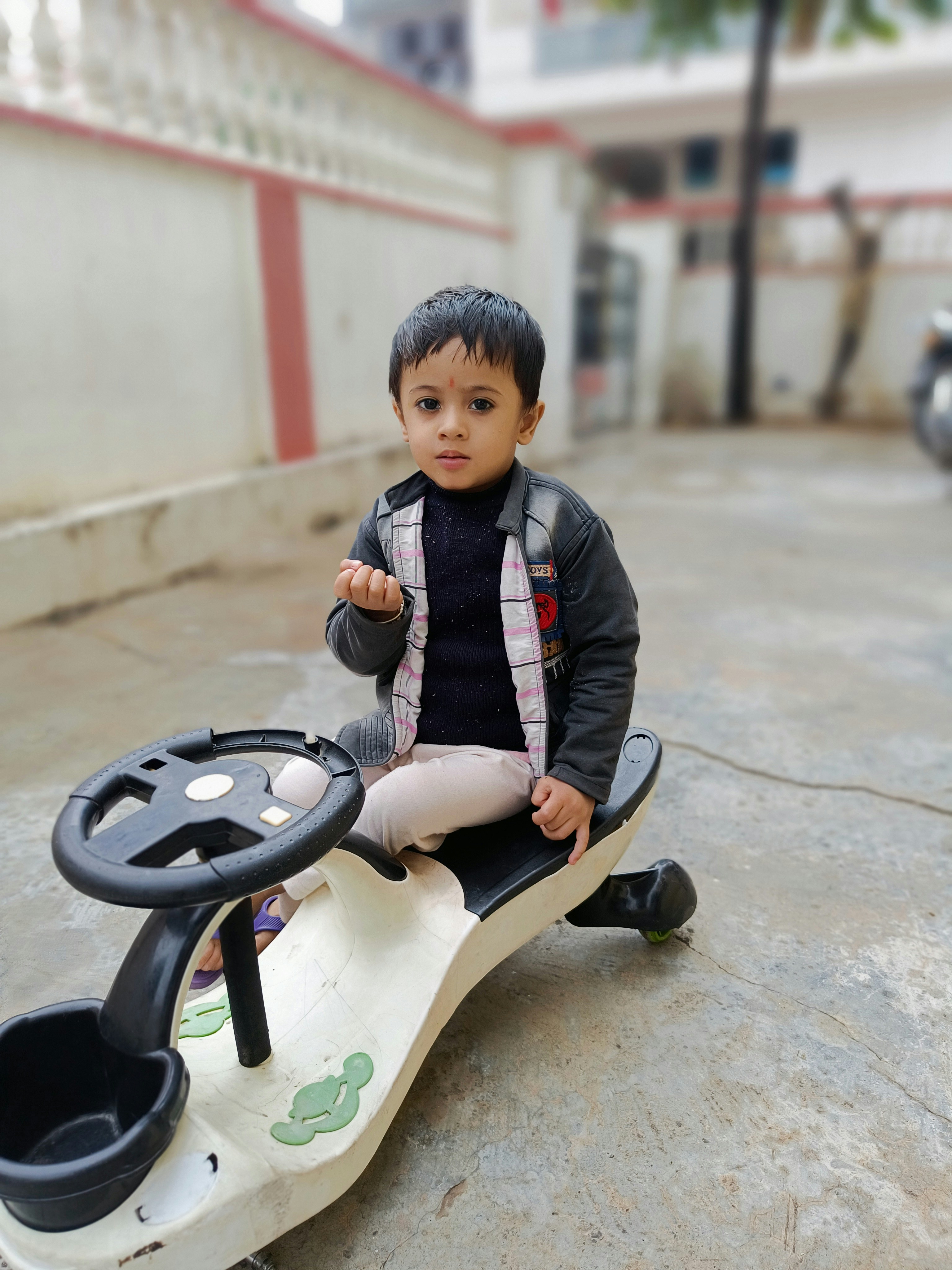 Tiny Captain of the Courtyard: First Test Drive in a Plastic Car