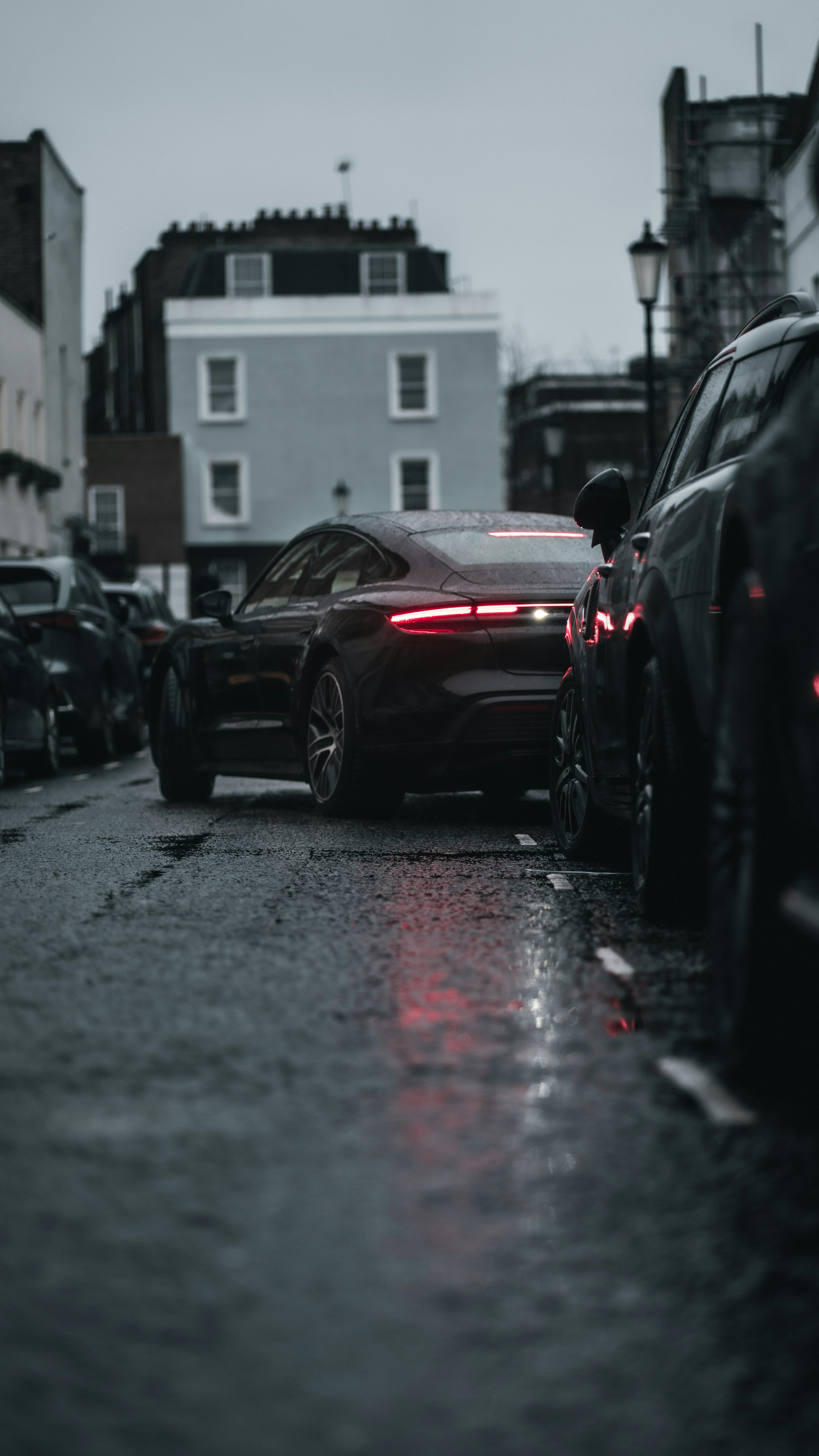 a couple of cars that are sitting in the street