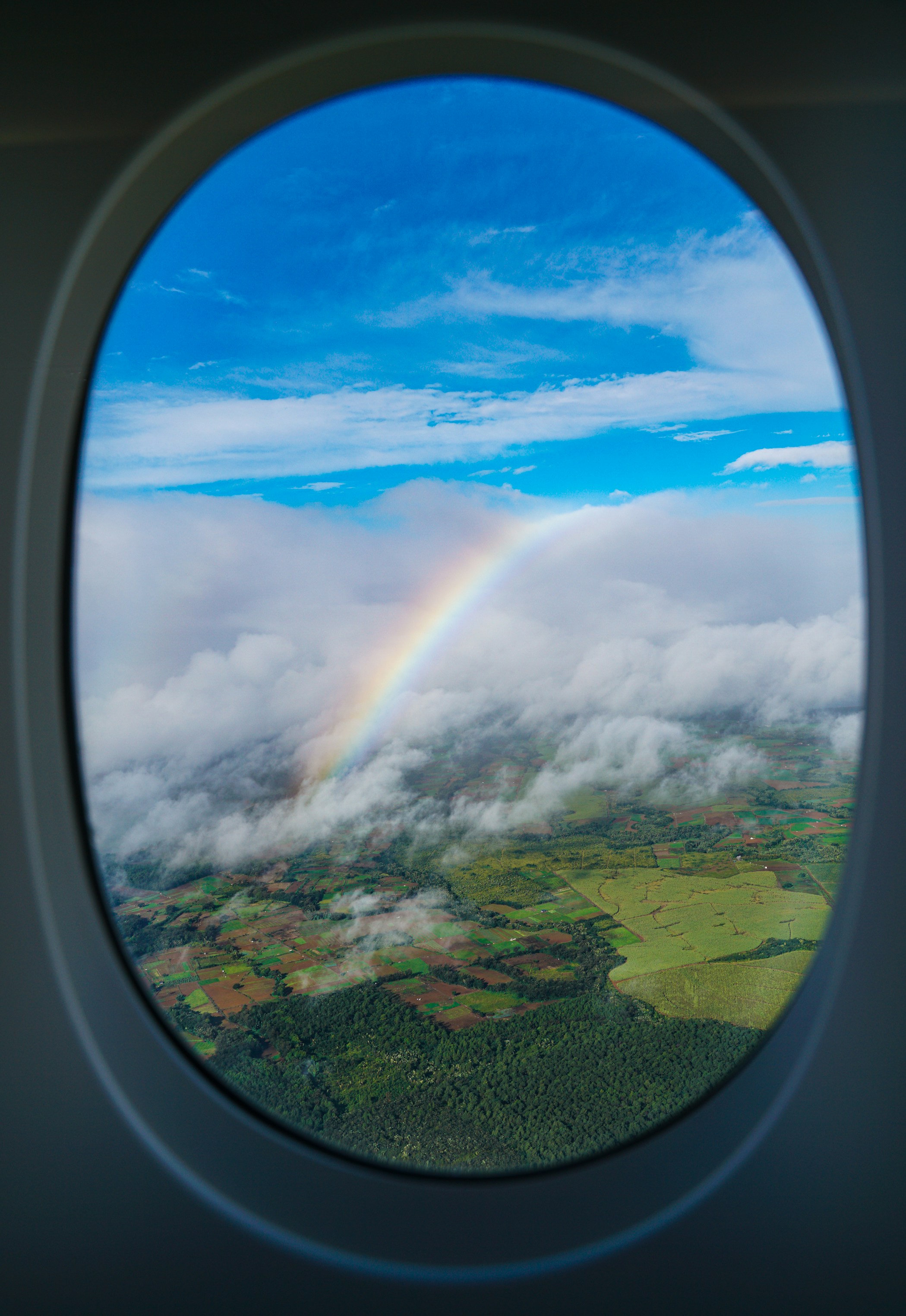 A view of a rainbow through an airplane window photo – Free Mauritius ...