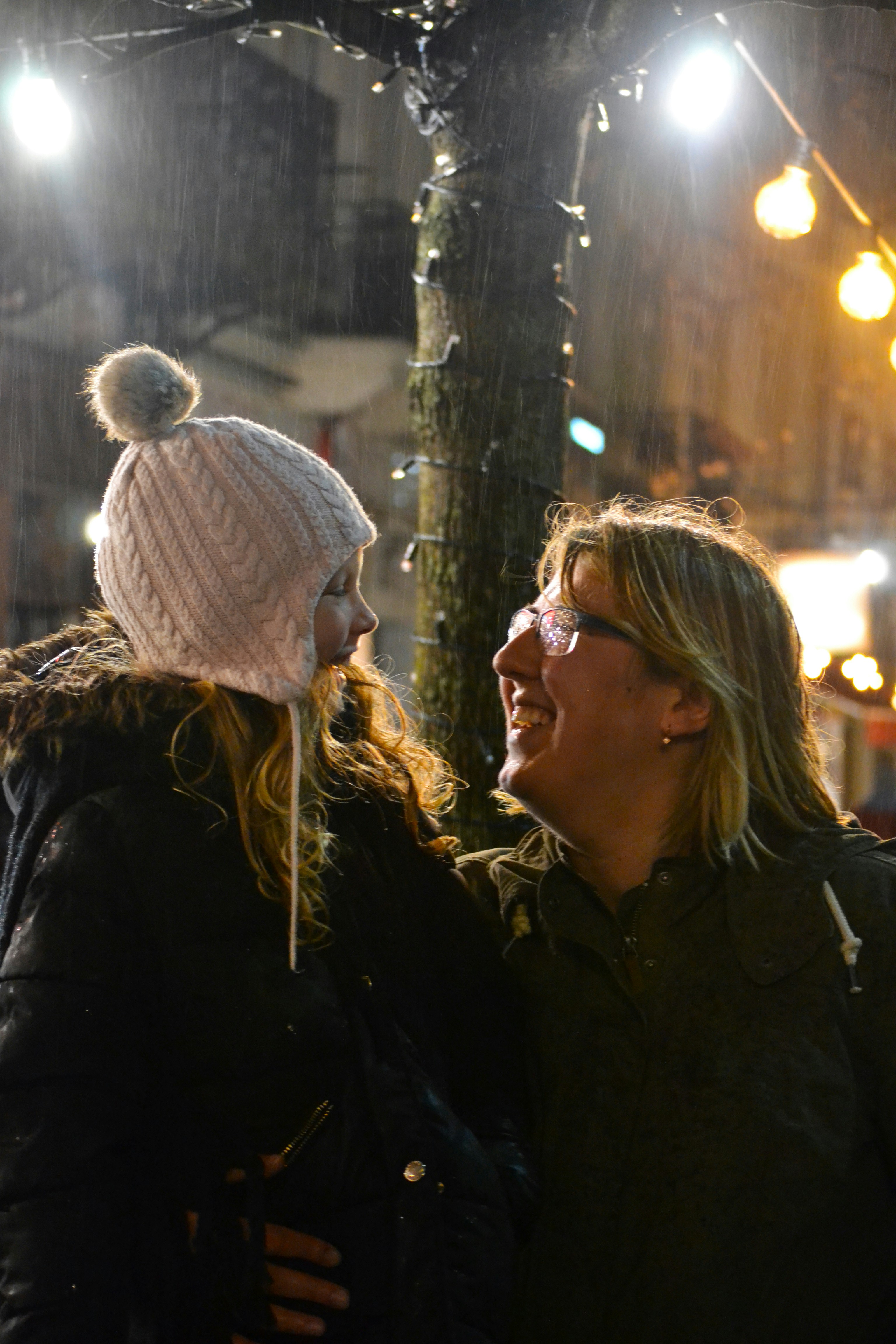 Warm Laughter Under Street Lights: A Winter Night Moment